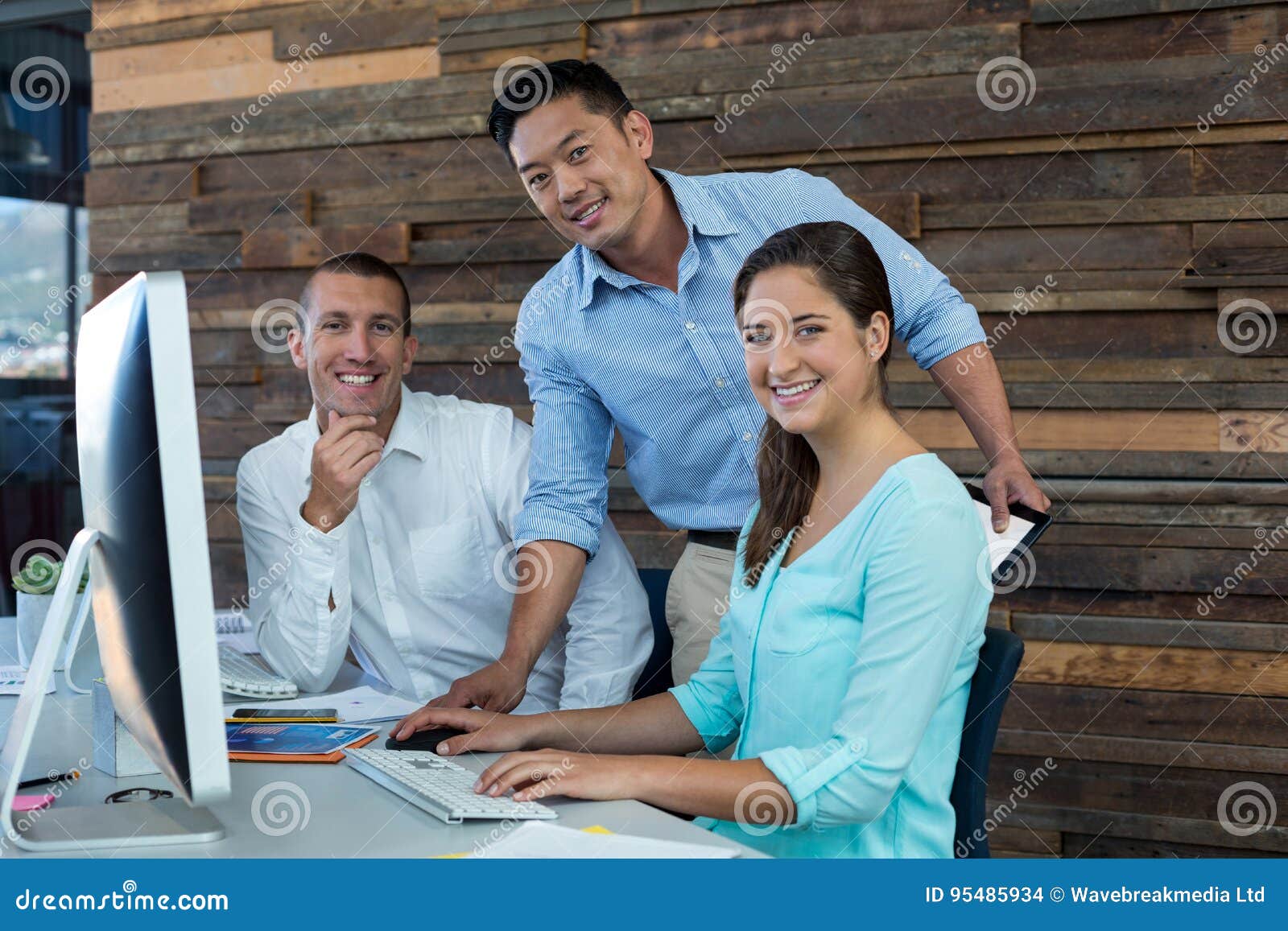 Portrait of Businesspeople Smiling at Desk Stock Photo - Image of ...