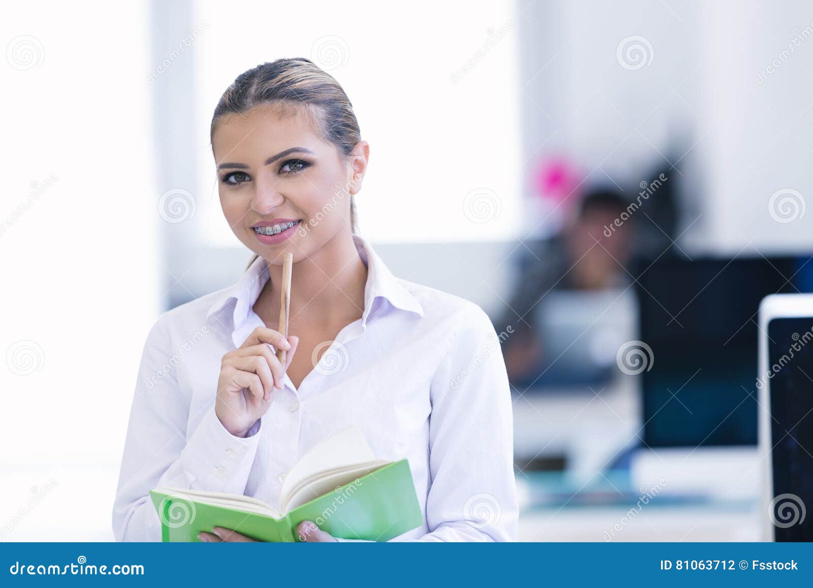 Portrait of Busy Secretary Looking at Camera Stock Photo - Image of ...