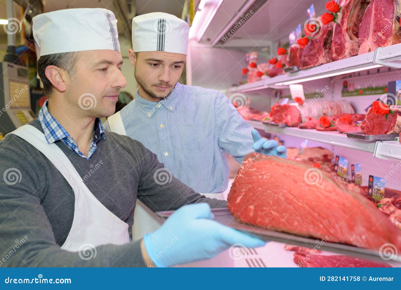 Portrait Butcher Restocking Shelf Stock Photo - Image of close, protein ...