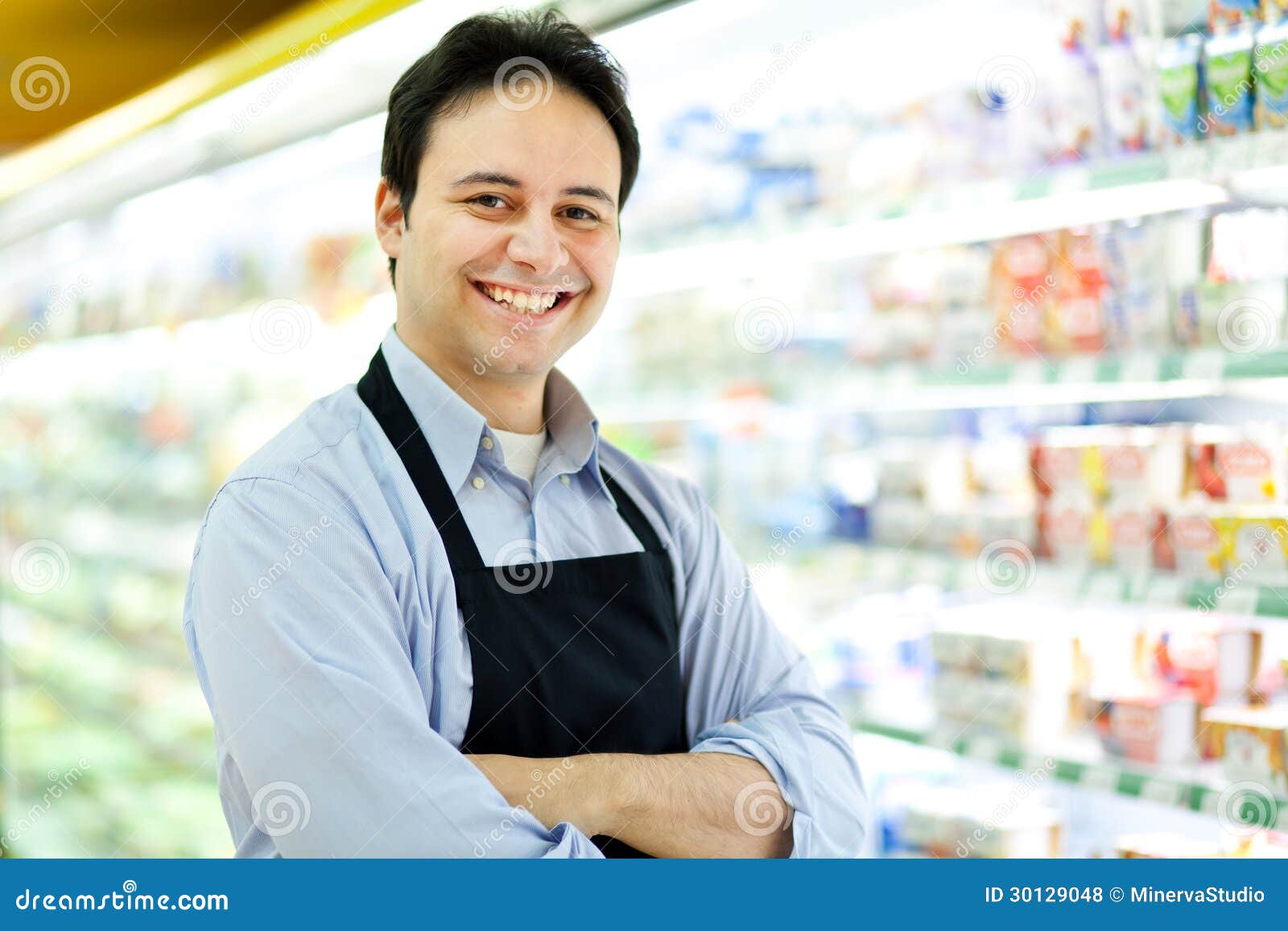 Happy worker in a grocery stock photo. Image of retail - 30129048