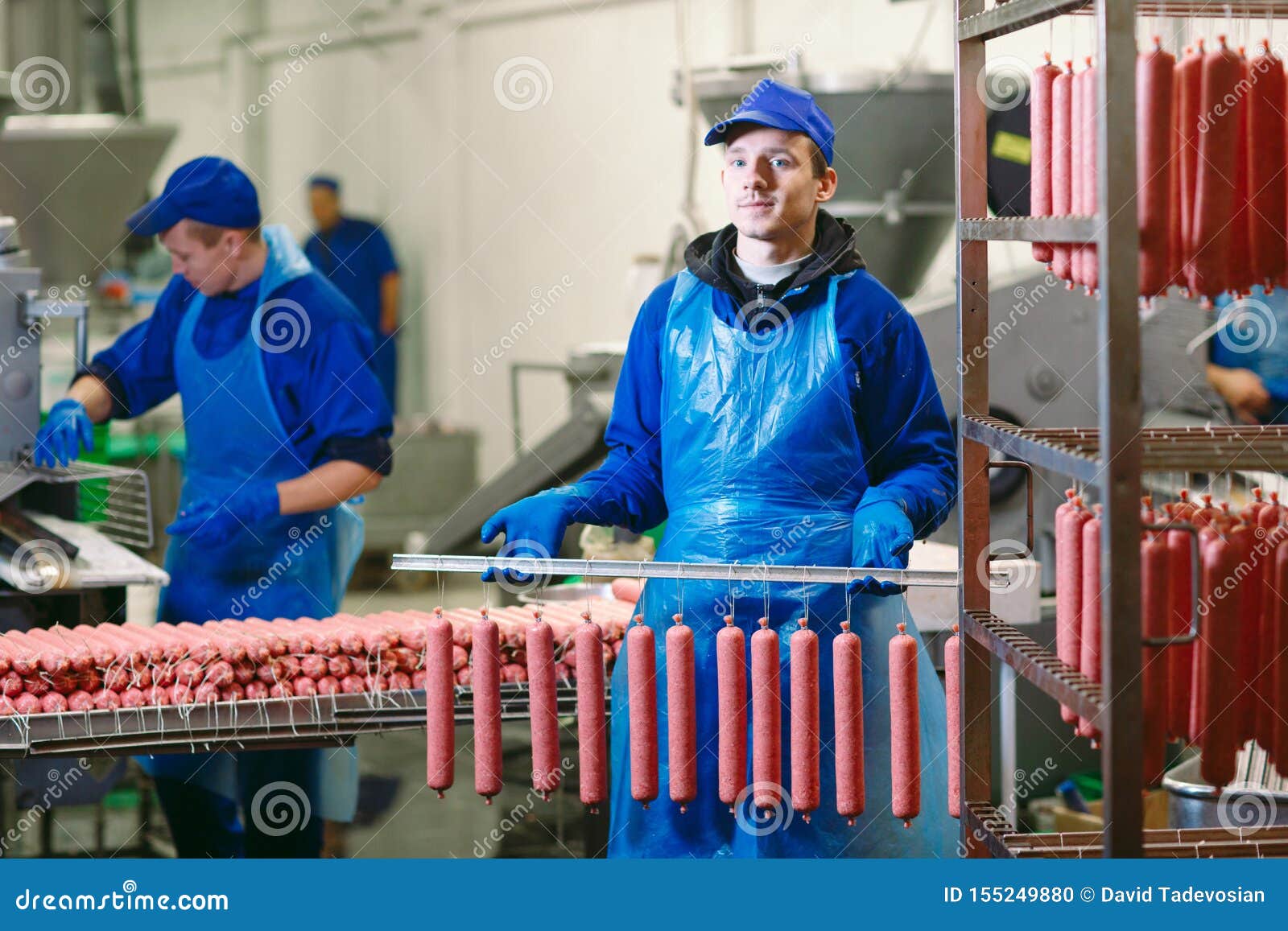 Portrait of Butchers Processing Sausages at Meat Factory. Stock Photo ...