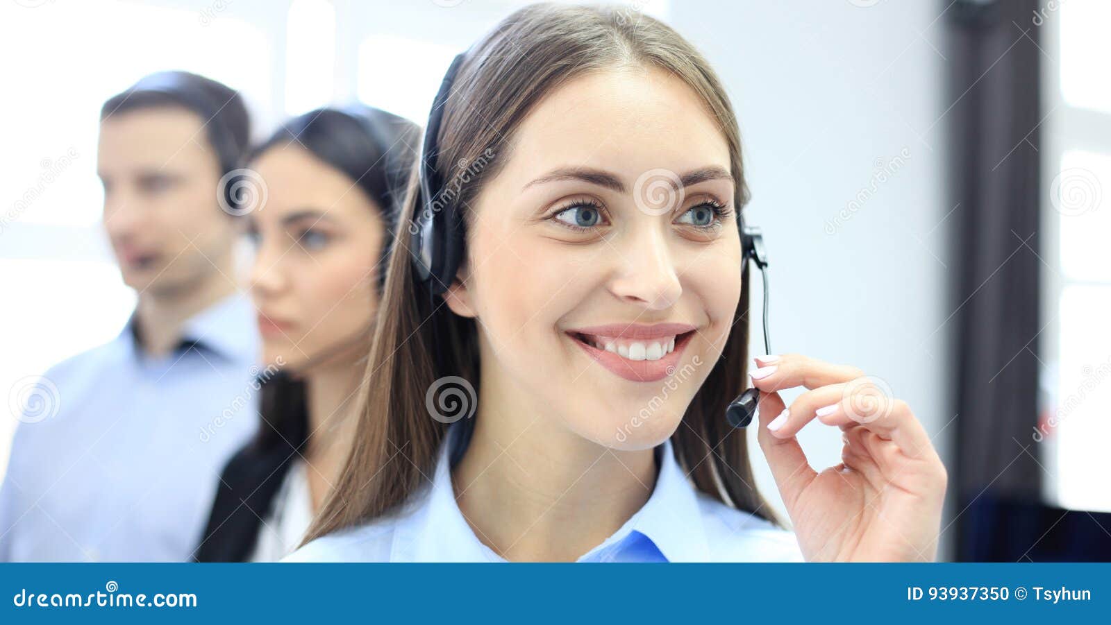 Portrait of Call Center Worker Accompanied by Her Team. Smiling ...