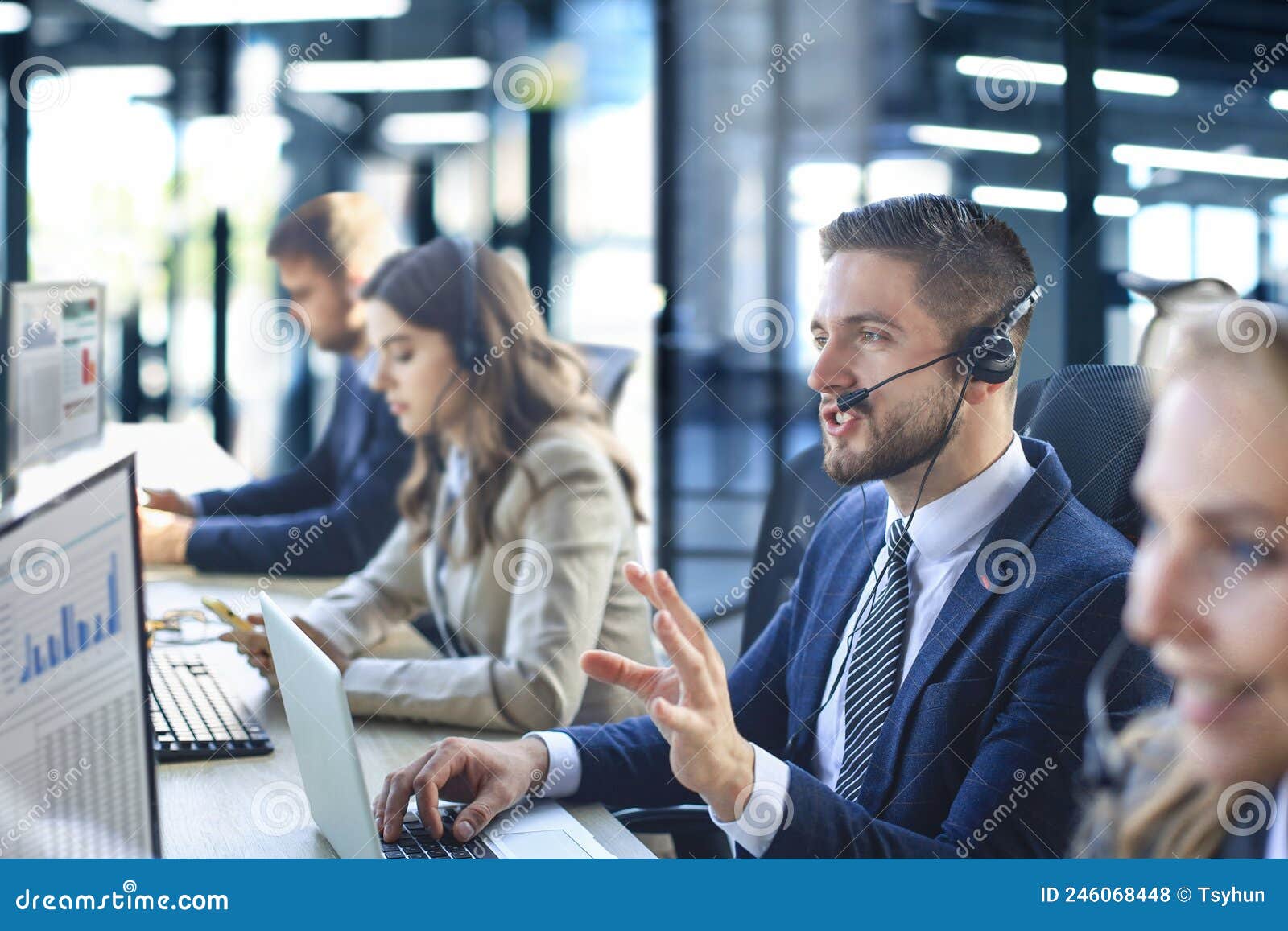 Portrait of Call Center Worker Accompanied by His Team. Smiling ...