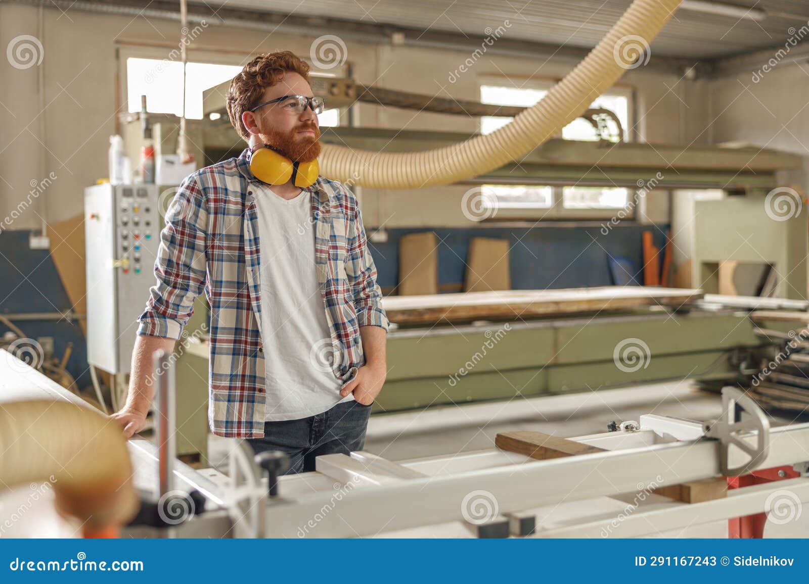 Portrait of Carpenter in Eyeglasses Standing on the Background on ...