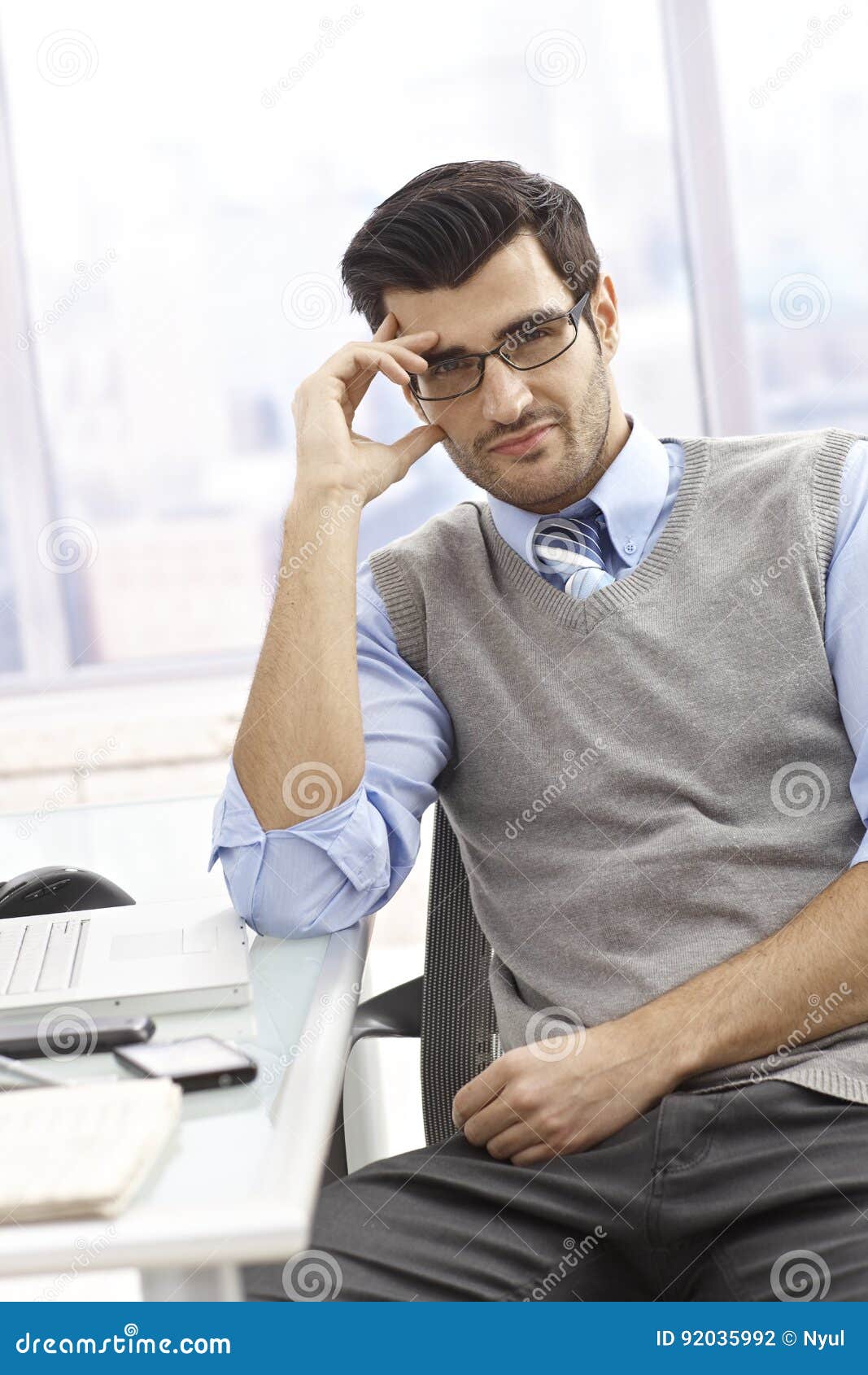 Portrait of Casual Office Worker Sitting at Desk Stock Photo - Image of ...