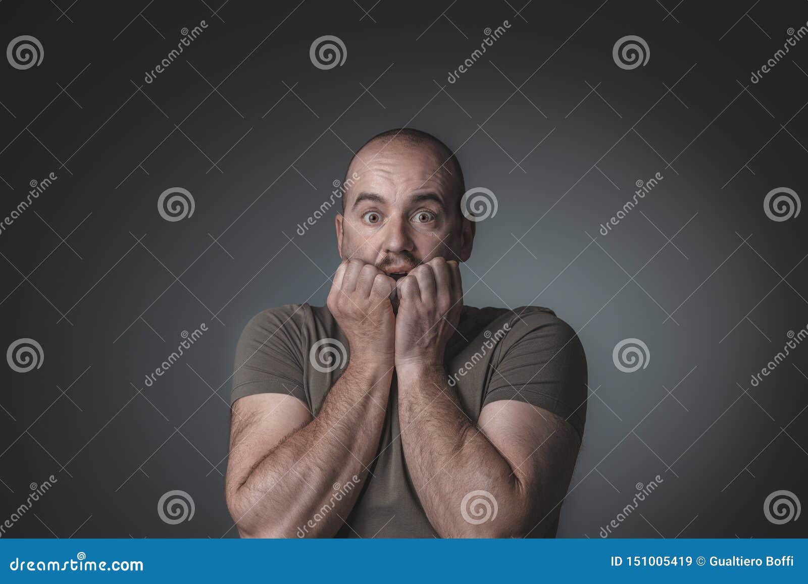 Portrait of Caucasian Man with Scared Expression Bringing His Hands To ...