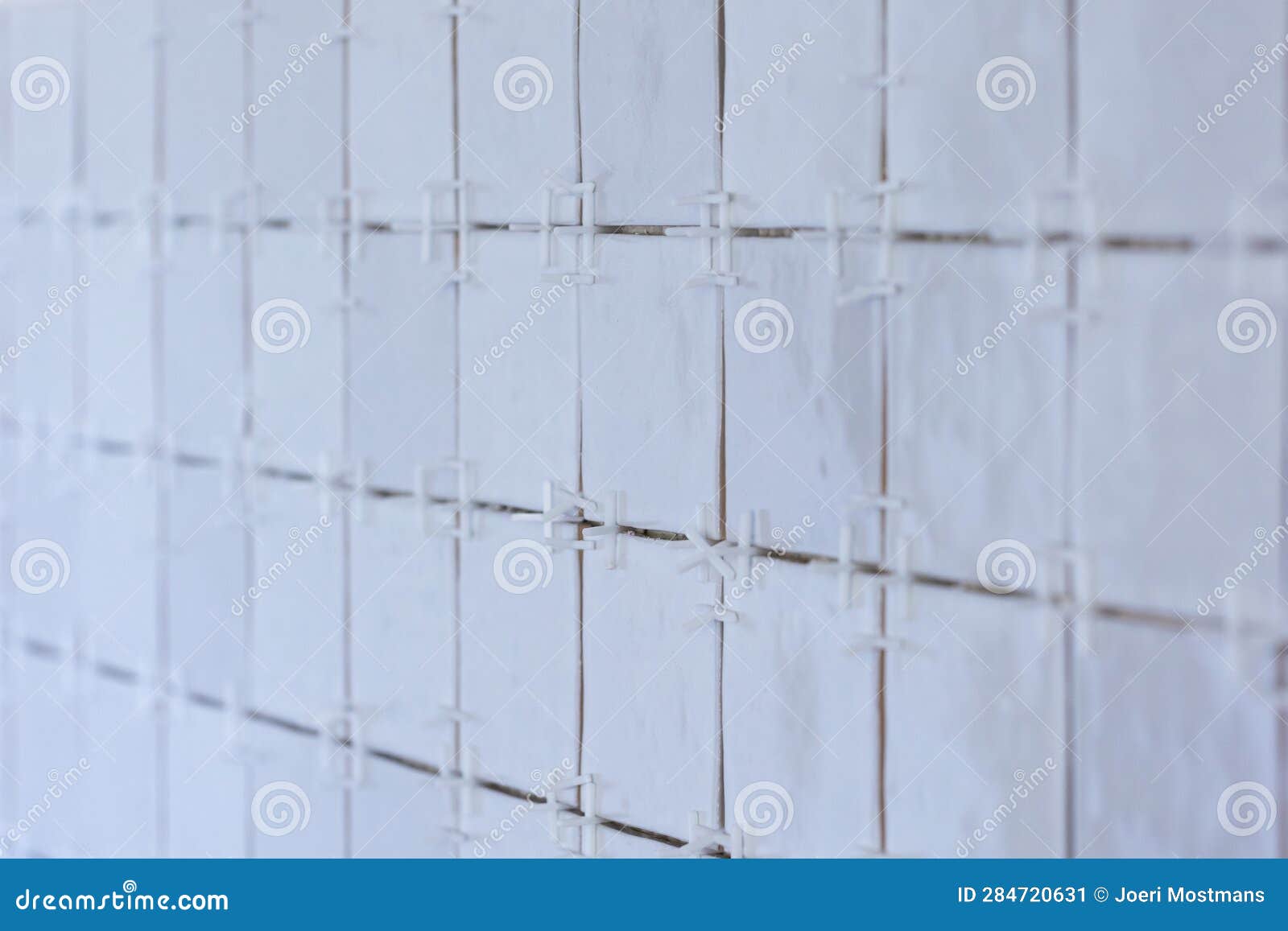 A Portrait of a Ceramic Tile Wall Under Construction. the Wall is Being ...