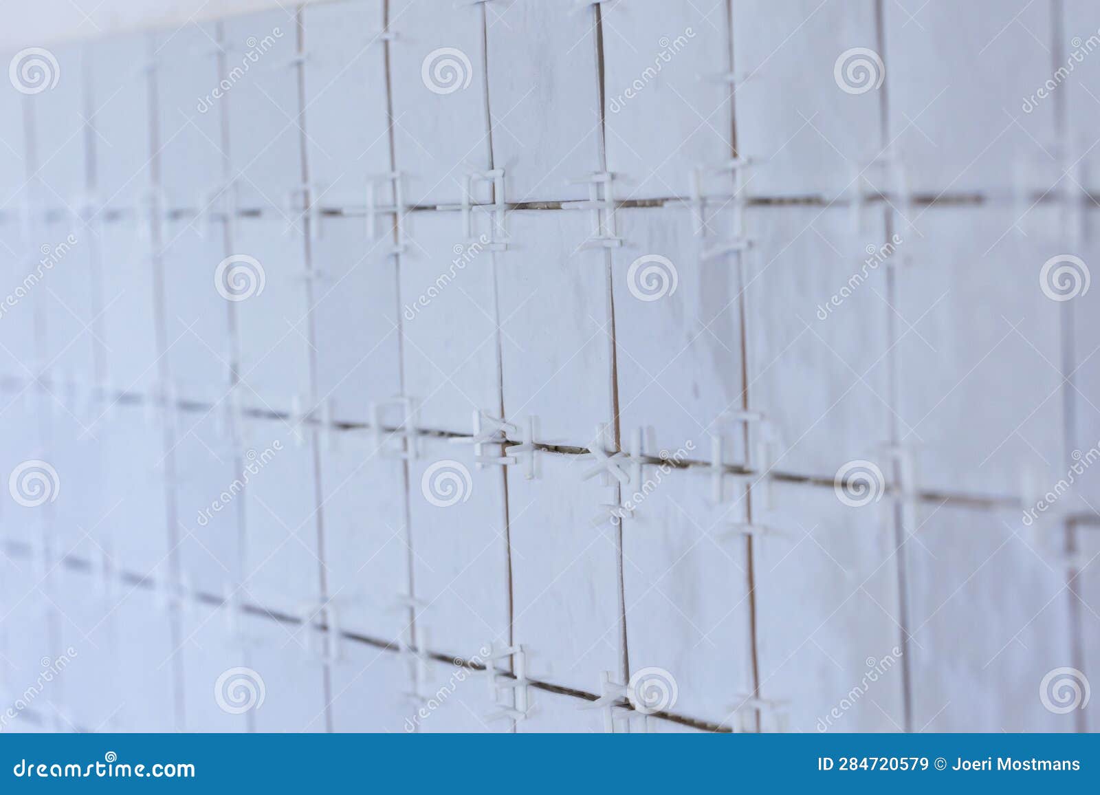 A Portrait of a Ceramic Tile Wall Under Construction. the Wall is Being ...
