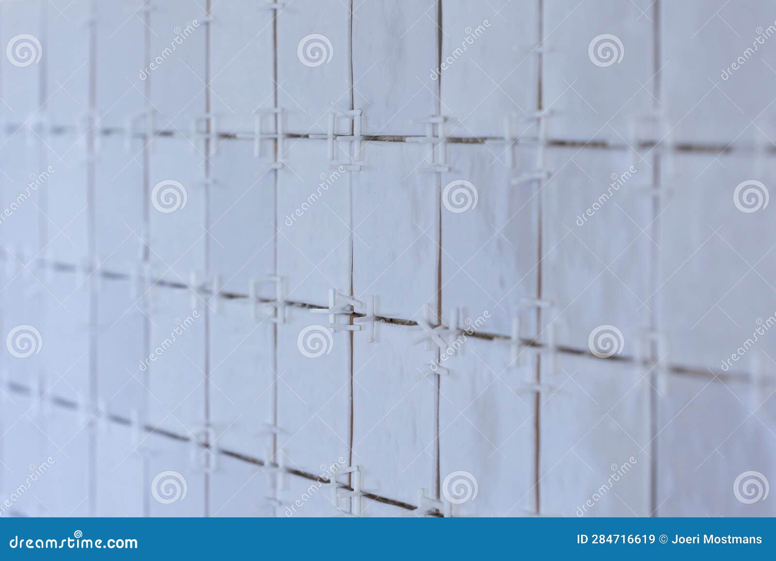 A Portrait of a Ceramic Tile Wall Under Construction. the Wall is Being ...