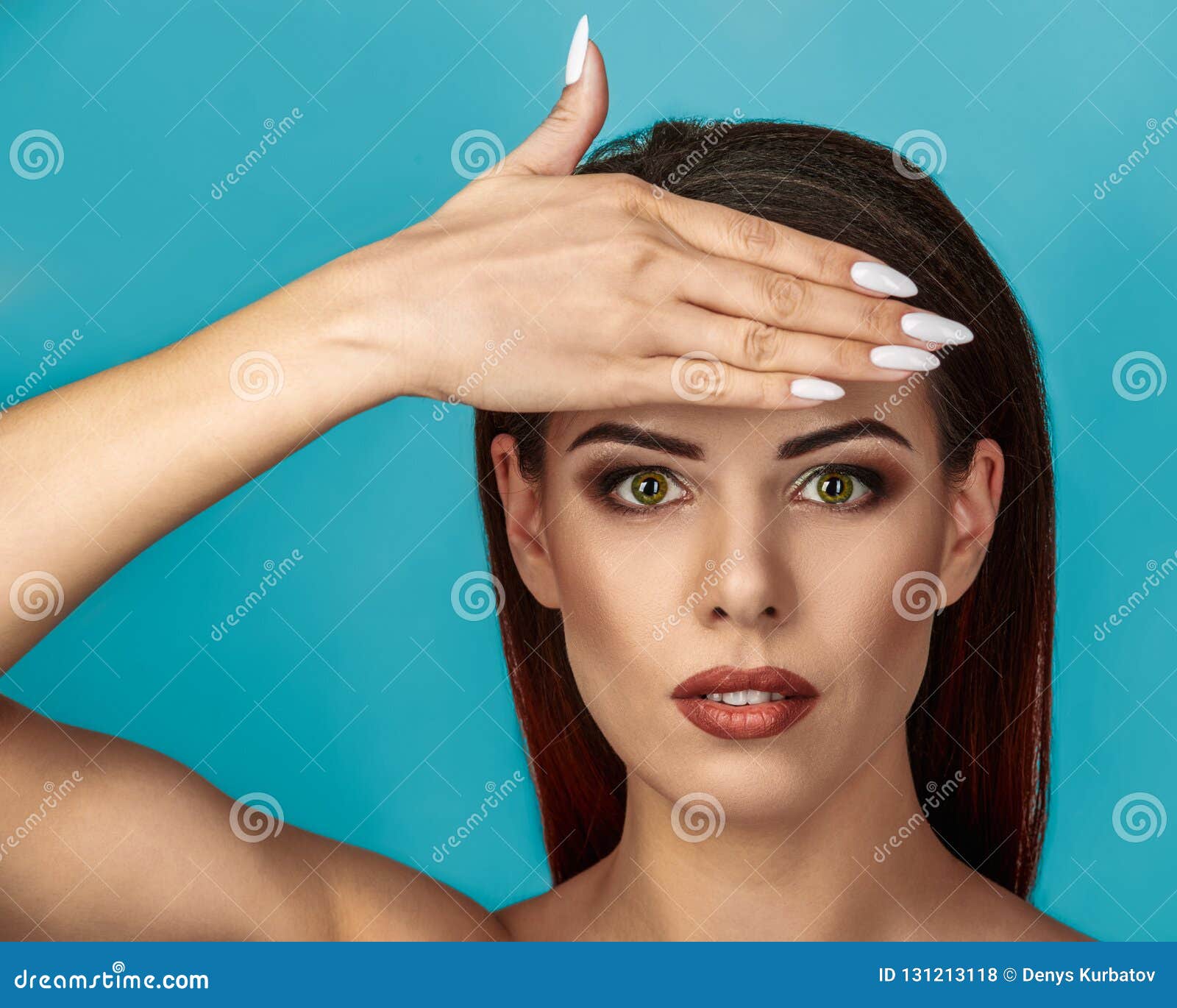 Brunette touching forehead stock photo. Image of fashion - 131213118
