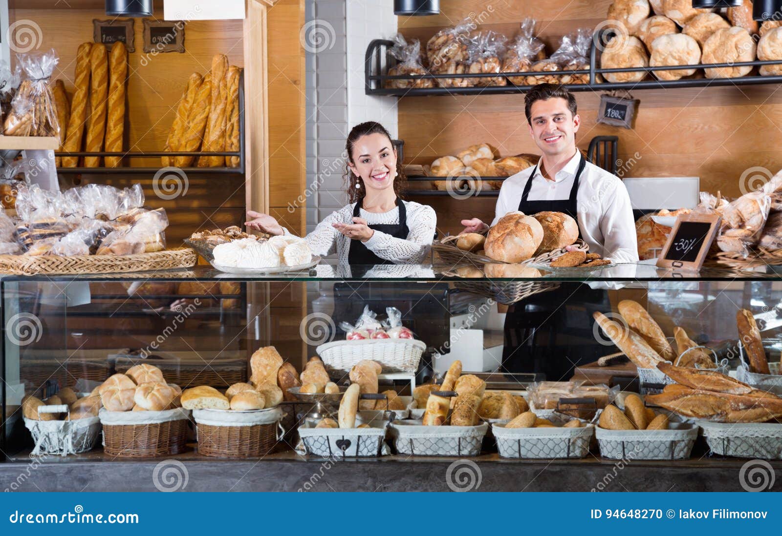 Portrait of Charming Couple at Bakery Display with Pastry Stock Photo ...