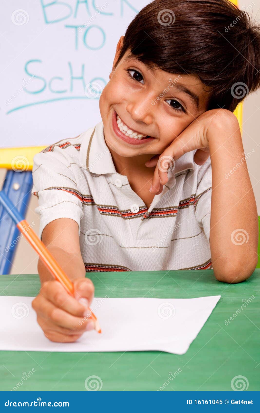 Portrait of Cheerful Boy Writing Notes Stock Image - Image of classroom ...