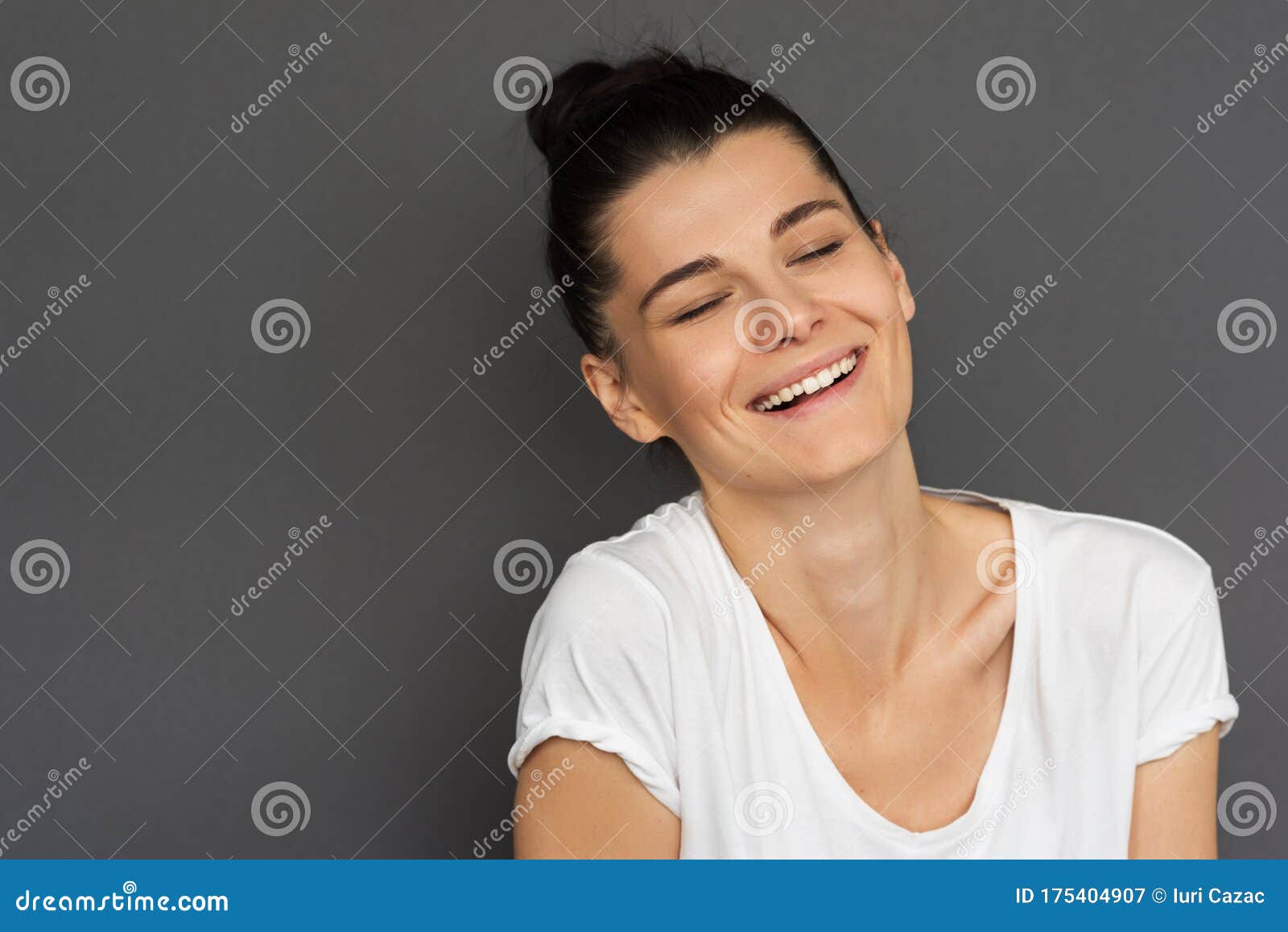 Portrait of Cheerful and Charming Young Caucasian Woman with Hair Bun ... Portrait of Cheerful and Charming Young Caucasian Woman with Hair Bun ...