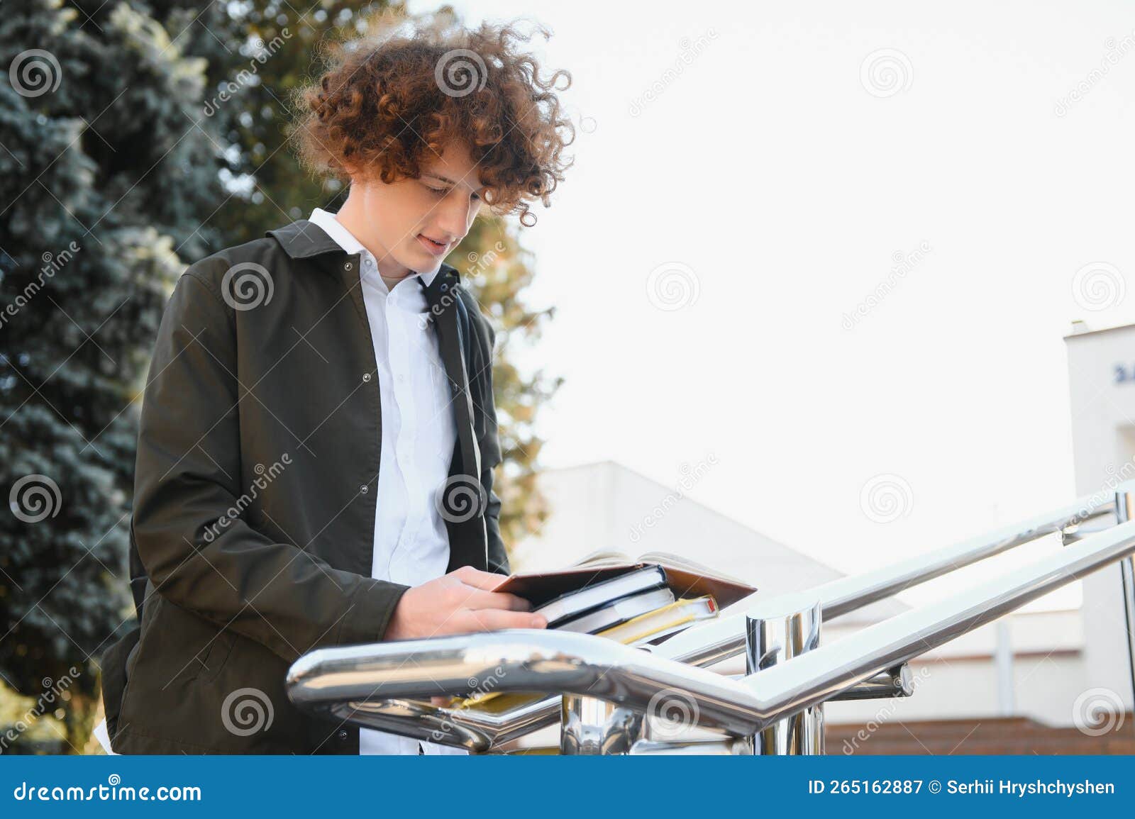 Portrait of a Cheerful College Student Standing Outside with Back Stock ...