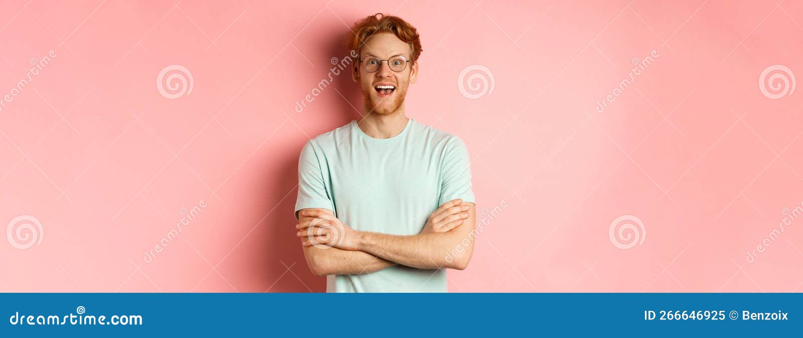 Portrait Of Cheerful European Man In Glasses Looking Amazed At Camera