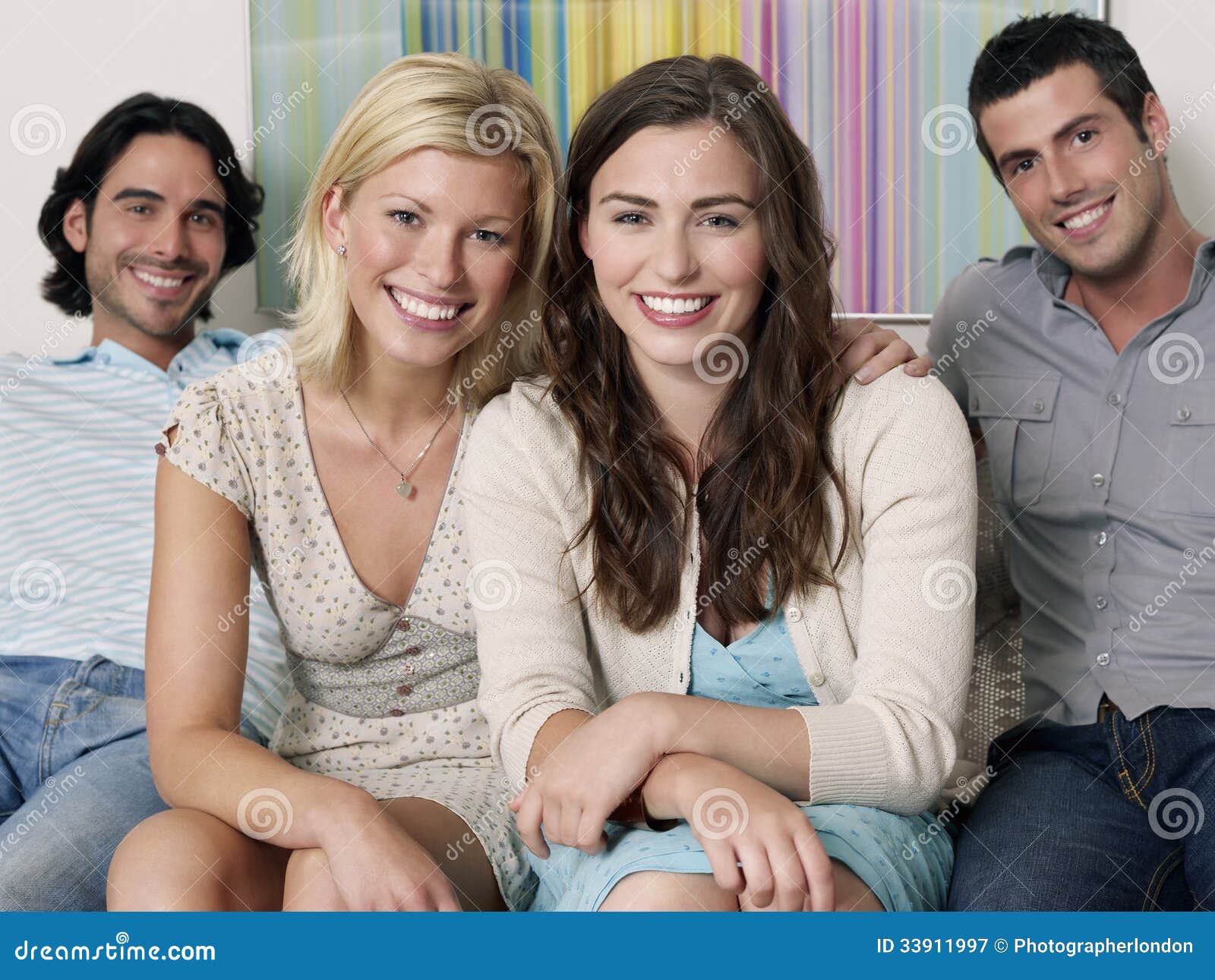 Portrait of Cheerful People on Sofa Stock Image - Image of denim ...