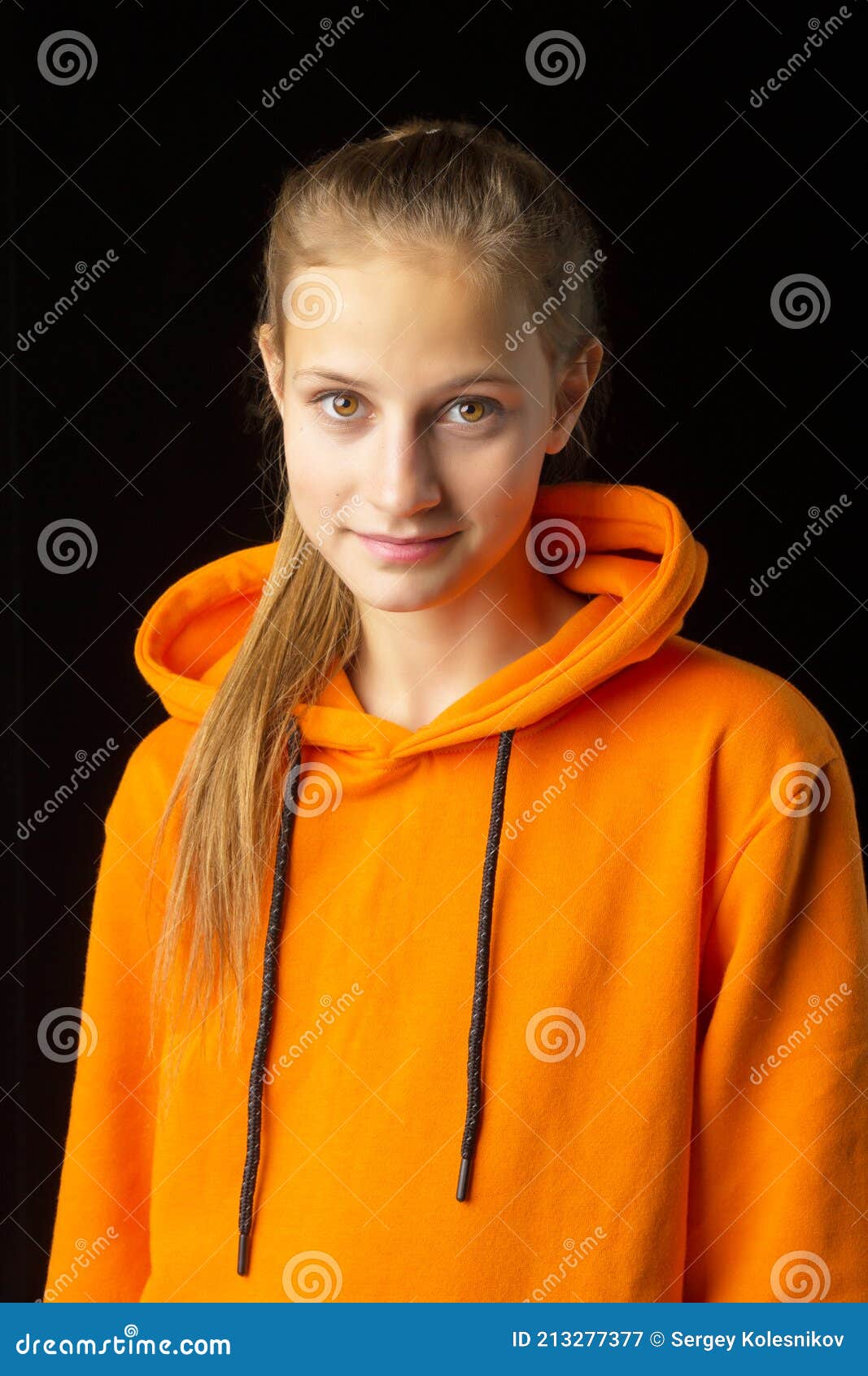 Portrait Of Cheerful Teen Girl In Orange Hoodie Stock Image Image Of