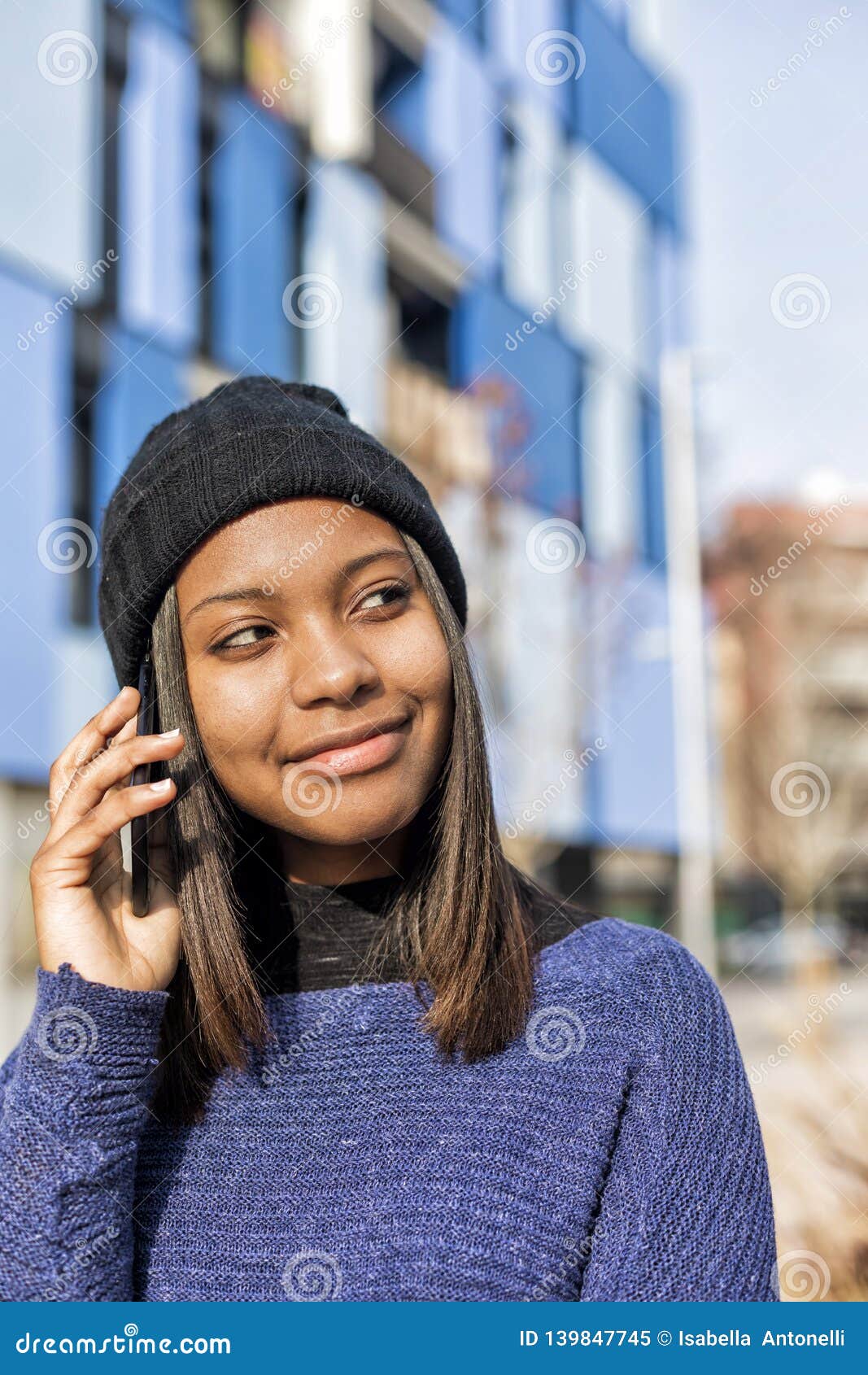 Portrait of a Cheerful Young African Woman Standing Outdoors and Making ... Portrait of a Cheerful Young African Woman Standing Outdoors and Making ...