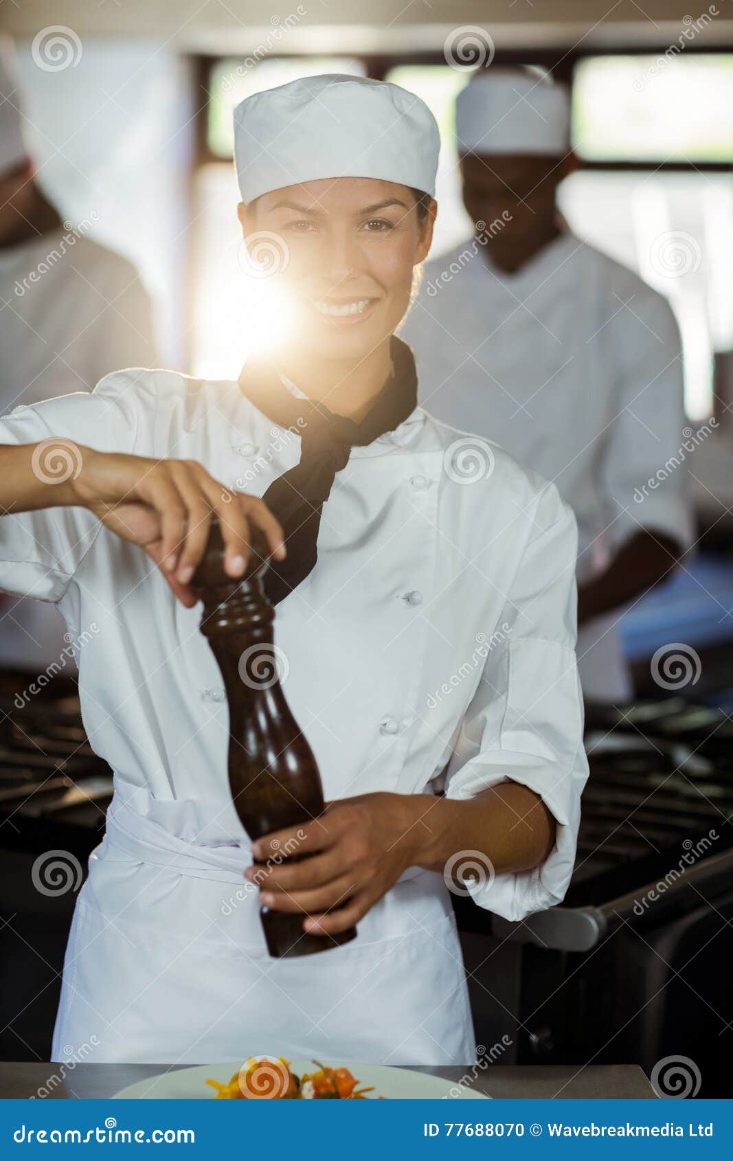 Portrait of Chef Sprinkling Pepper on a Meal Stock Photo - Image of ...