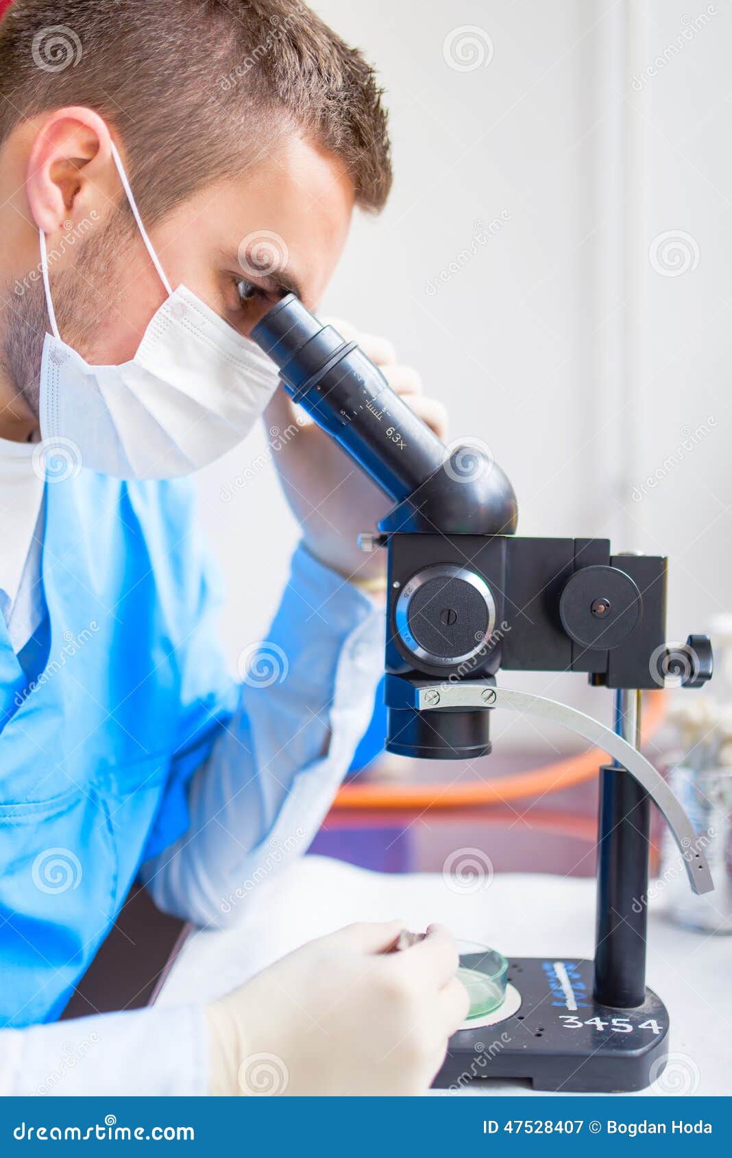 Portrait of Chemist Working with Microscope in Special Laboratory Stock ...