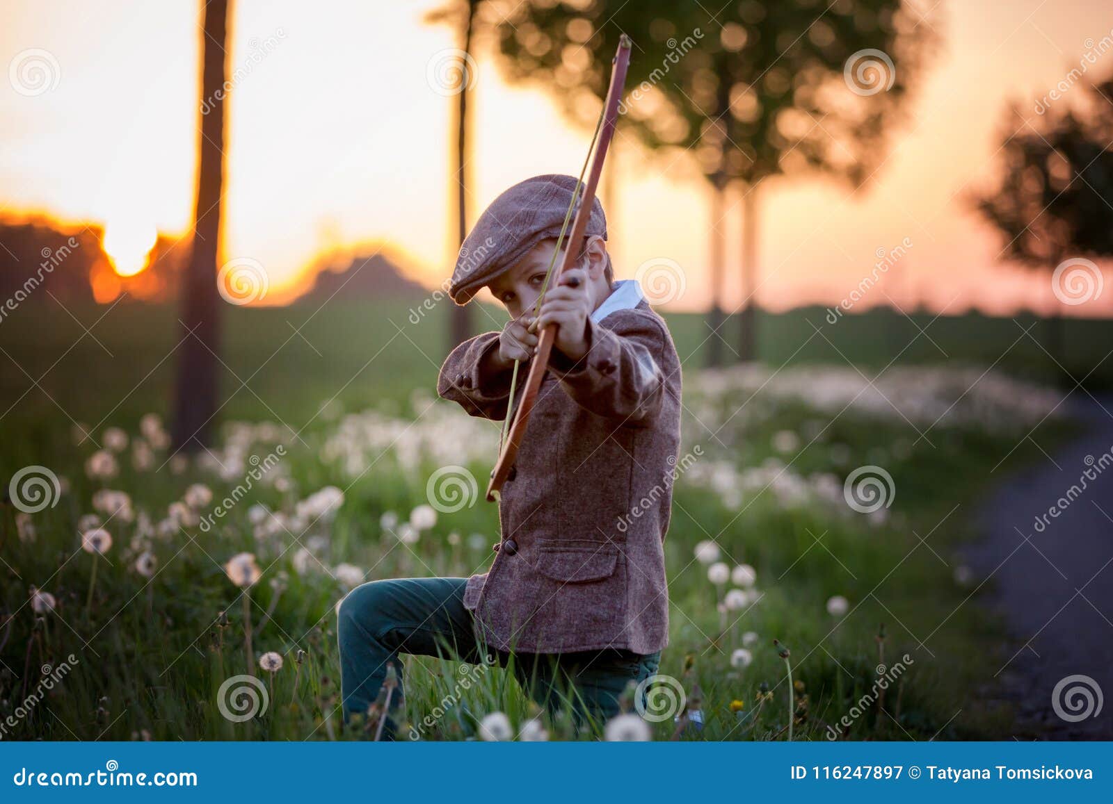 Portrait of Child Playing with Bow and Arrows, Archery Shoots a Stock ...