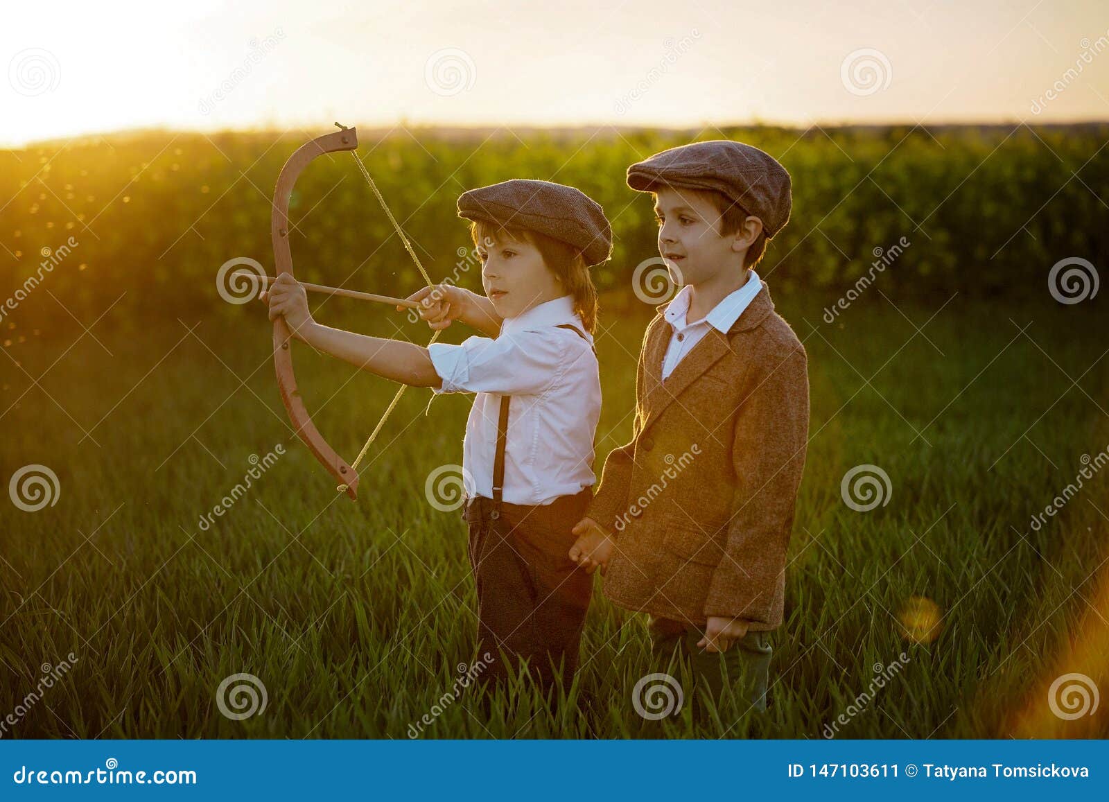 Portrait of Child Playing with Bow and Arrows, Archery Shoots a Bow at ...