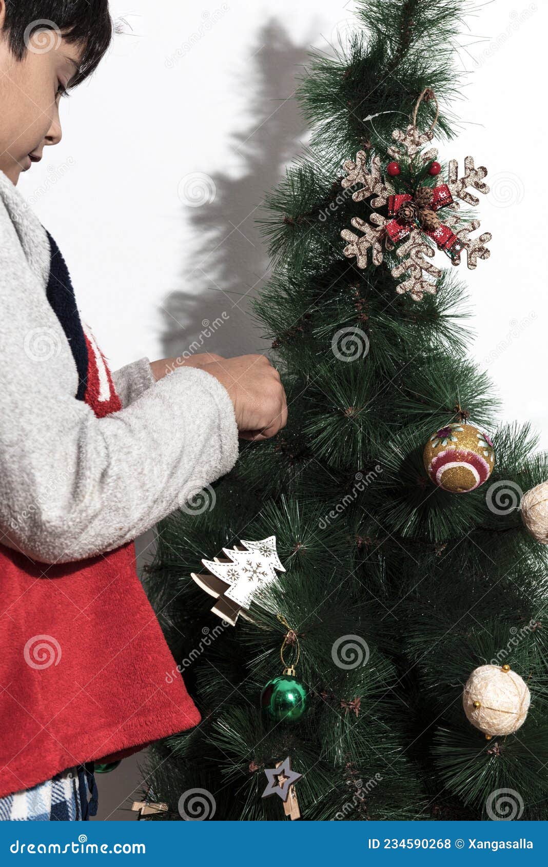 Portrait of a Child Putting Up the Christmas Tree Decorations Stock ...
