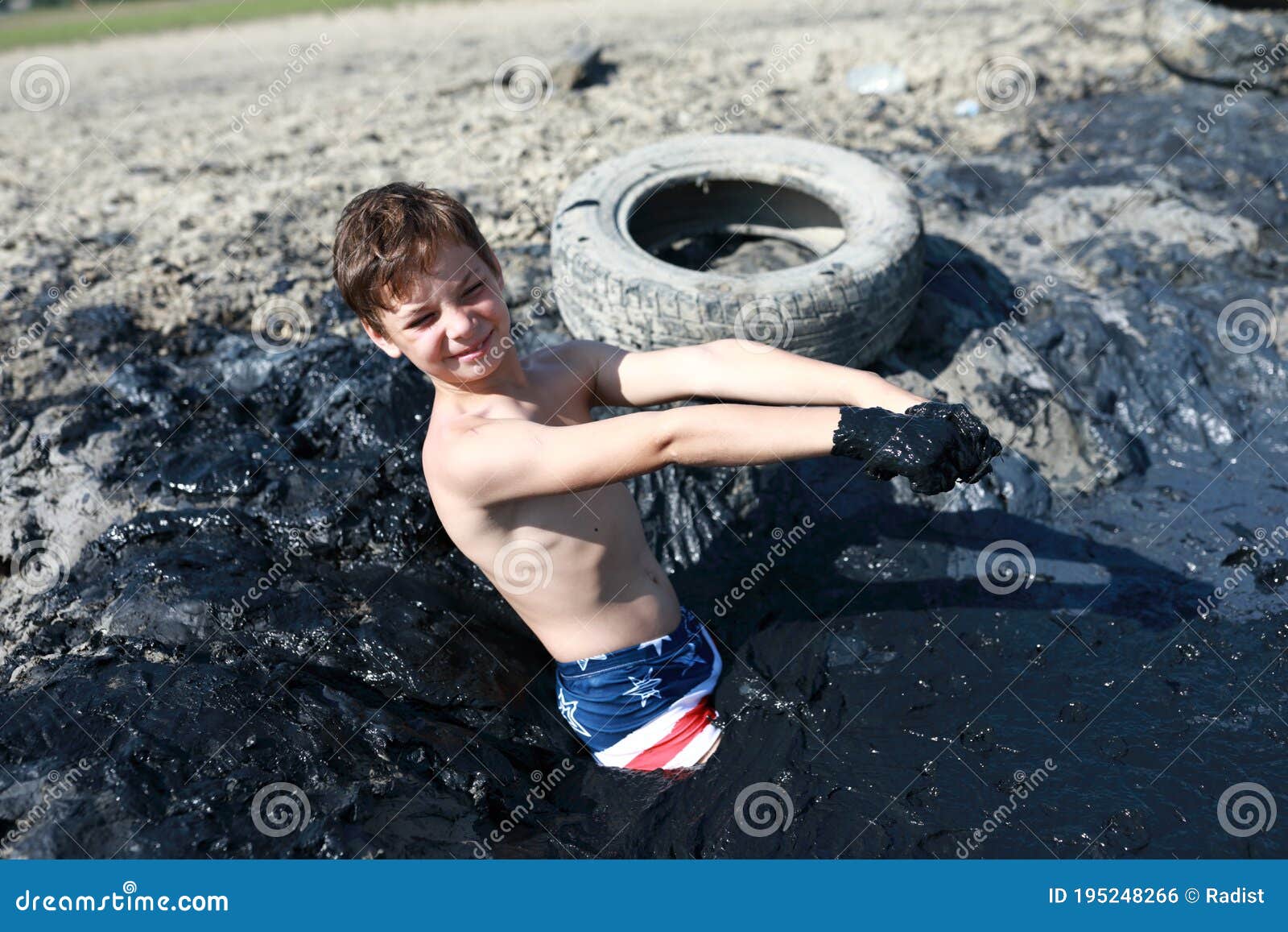 Child Standing in Pool of Healing Mud Stock Photo - Image of care ...