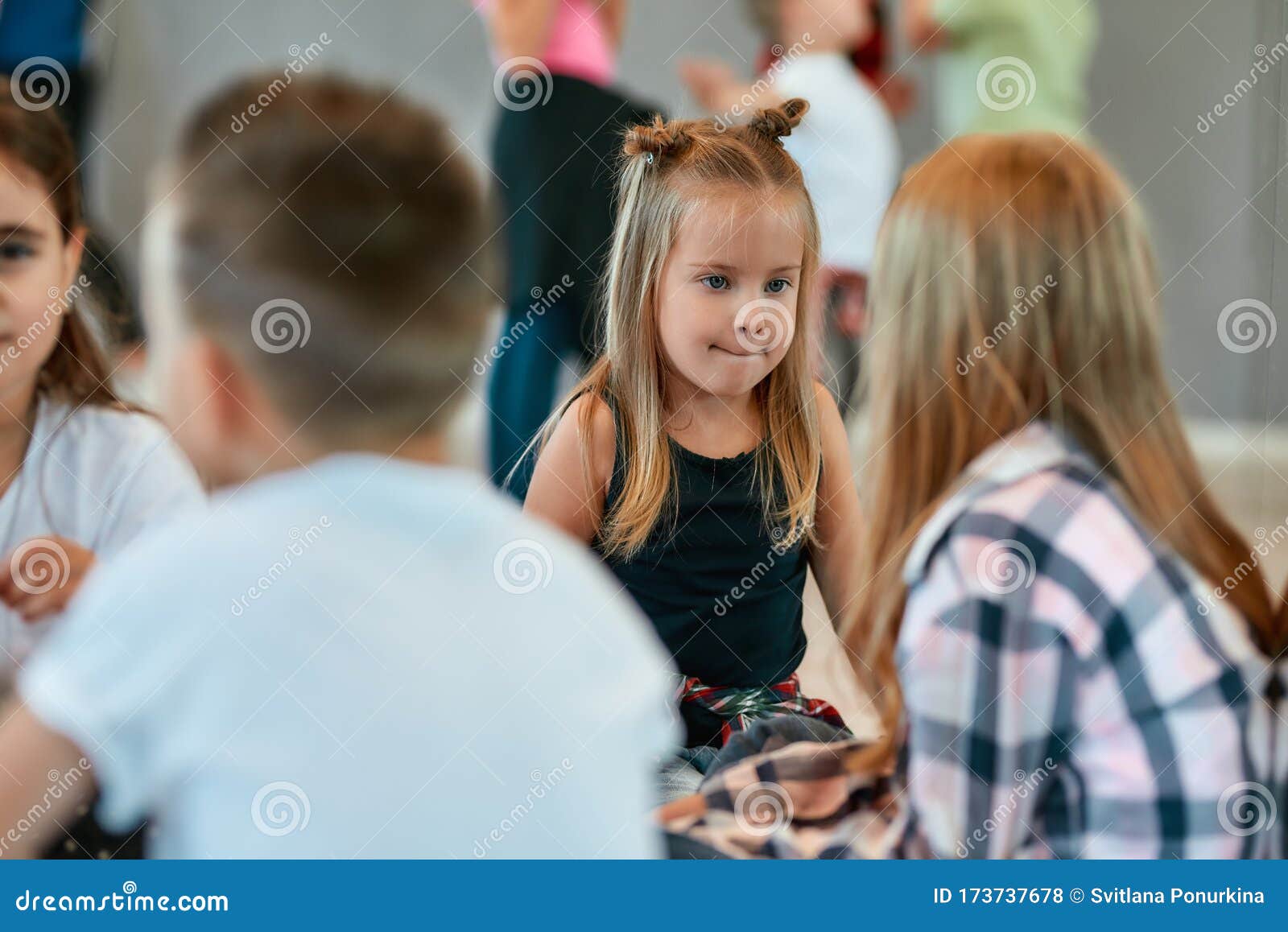 Portrait of Children Talking with Each Other while Sitting on the Floor ...