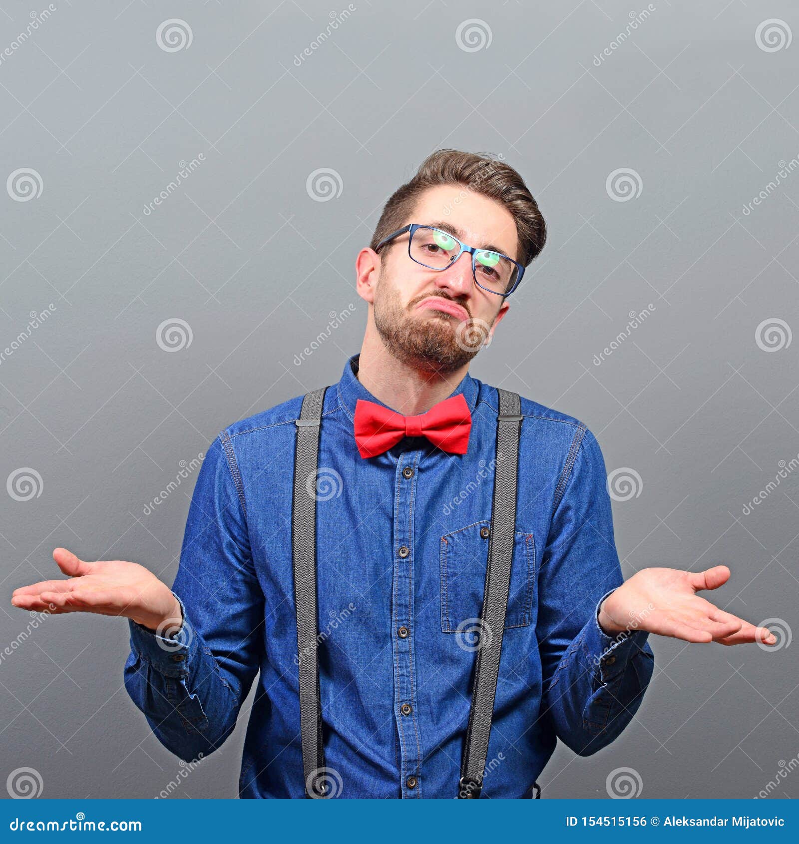 Portrait Of Clueless Confused Man In Worker Denim Shirt Shrugging ...