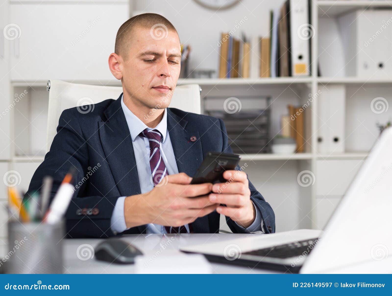 Portrait of the Head of the Company Working in the Office at the ...