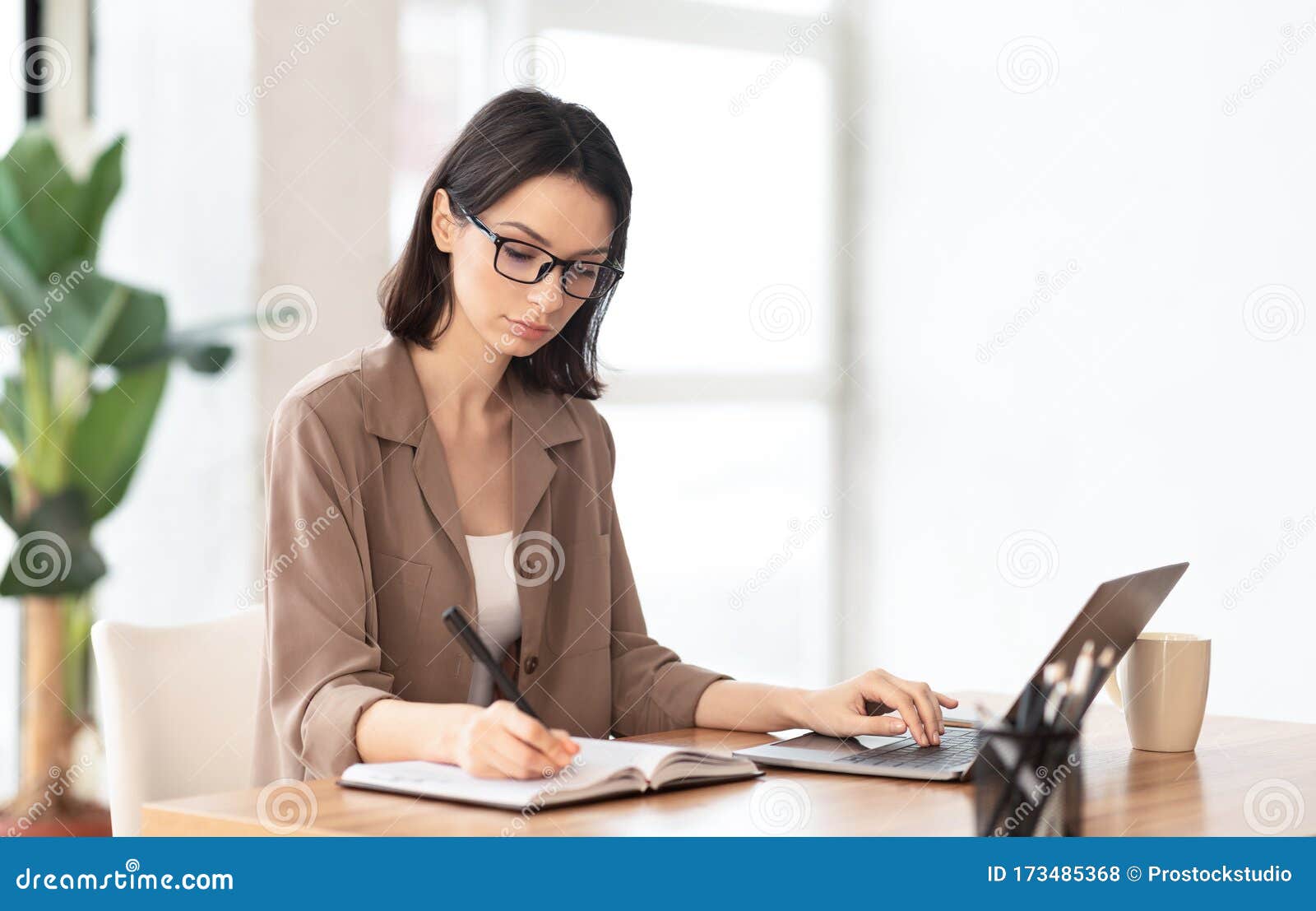 Portrait of Concentrated Manager Writing in Notebook Stock Photo ...