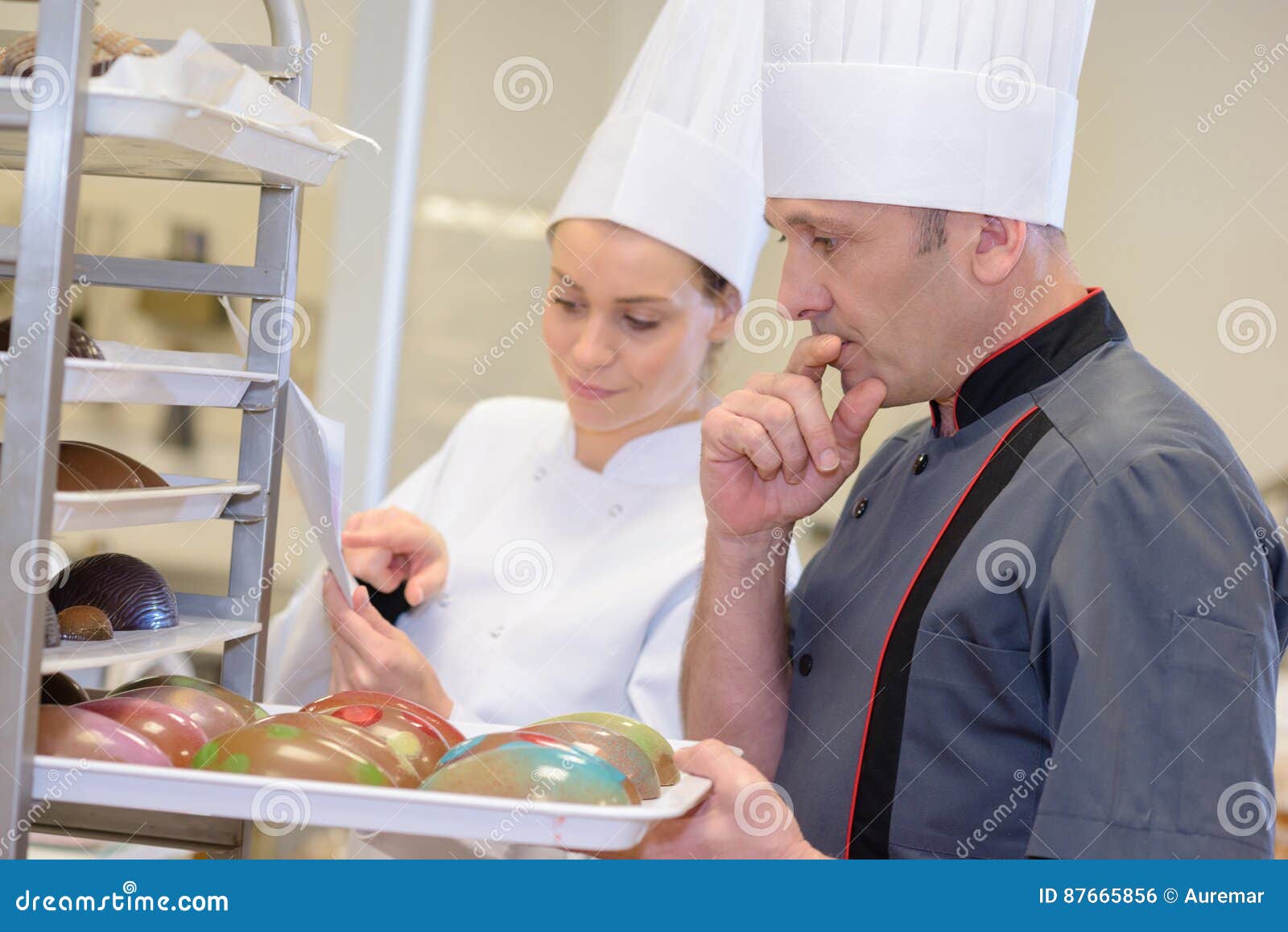 Portrait Confident Bakers Packing Pastries in Bakery Stock Photo ...