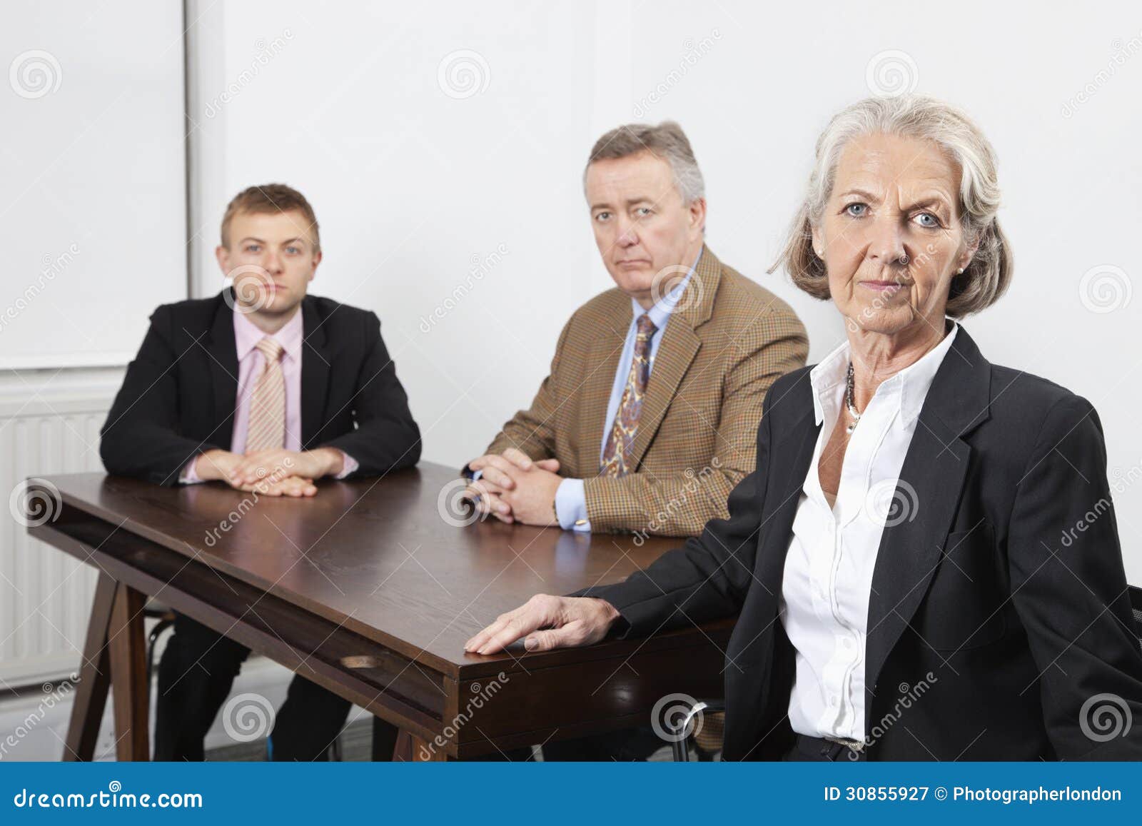 Portrait of Confident Business Group at Desk in Office Stock Image ...