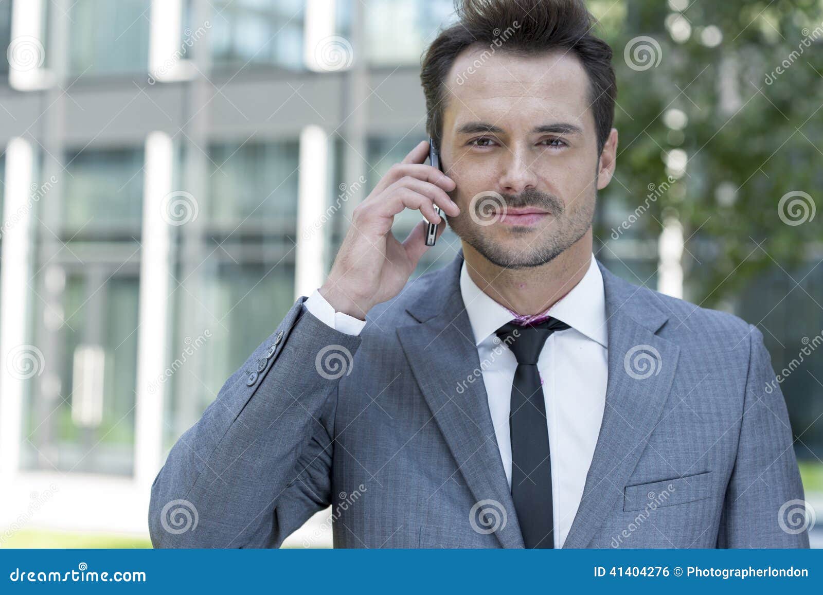 Portrait of Confident Businessman Using Cell Phone Outside Office Stock ...