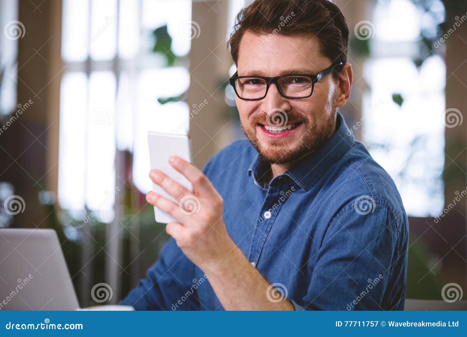 Portrait of Confident Businessman Using Mobile Phone at Office Stock ...