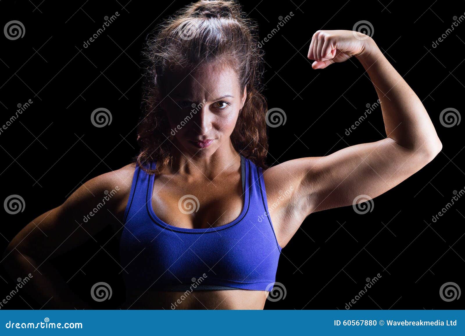 Portrait of Confident Female Athlete Flexing Muscles Stock Photo ... Portrait of Confident Female Athlete Flexing Muscles Stock Photo ...
