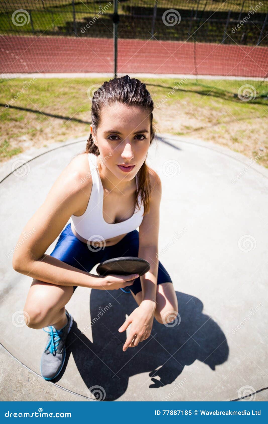 Portrait of Confident Female Athlete Holding a Discus Stock Image ... Portrait of Confident Female Athlete Holding a Discus Stock Image ...