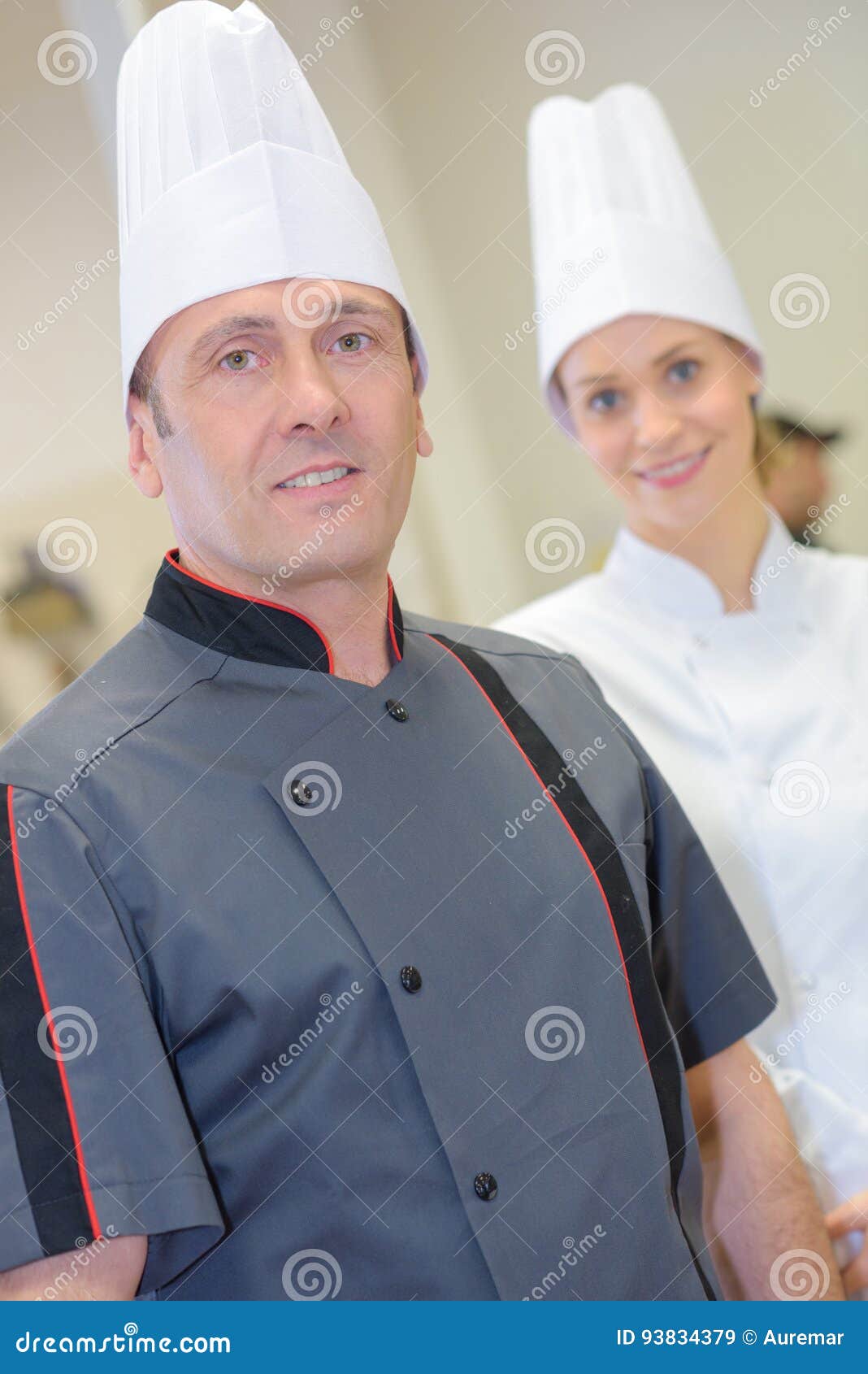 Portrait Confident Female and Male Chef in Kitchen Stock Image - Image ...