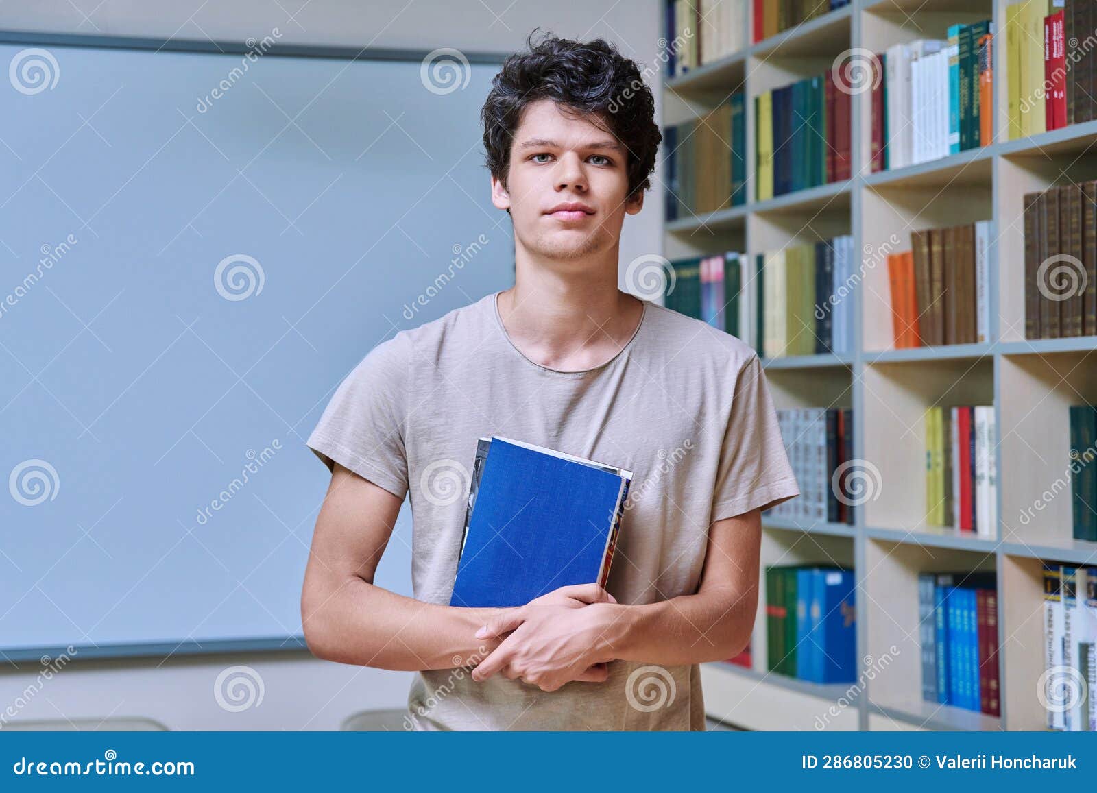 Portrait of Confident Guy College Student Looking at Camera Inside ...