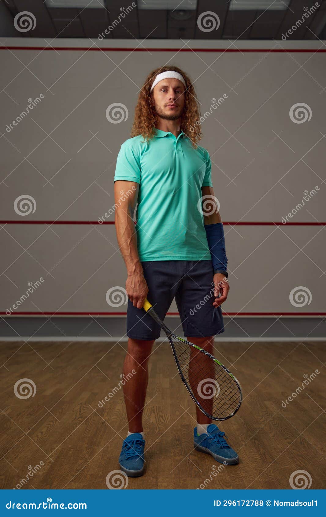 Portrait of Confident Male Squash Player Standing with Racket Ready for ...