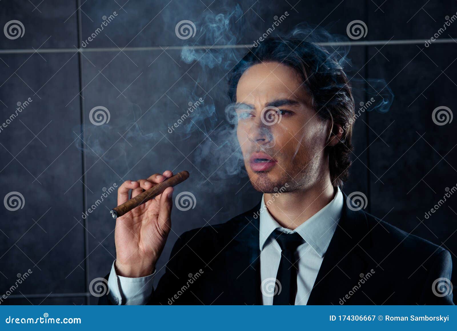 Portrait of a Confident Man in Black Suit Smoking a Cigar Stock Image ...