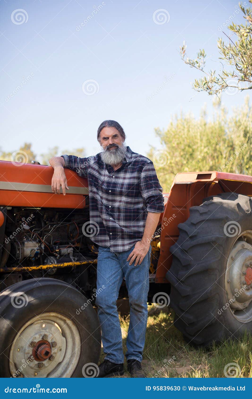 Portrait of Confident Man Leaning on Tractor Stock Photo - Image of ...