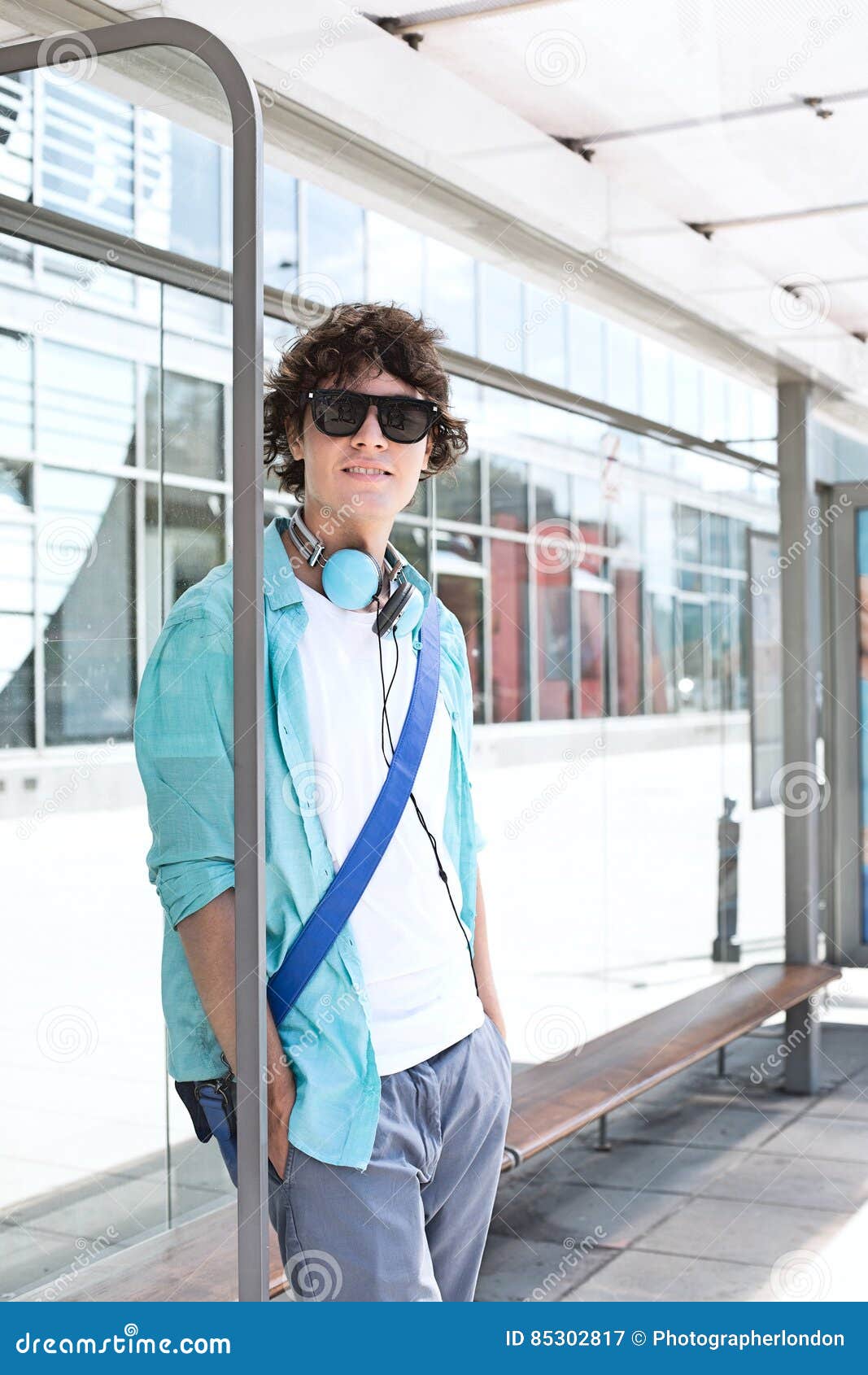 Portrait of Confident Man Waiting at Bus Stop Stock Image - Image of ...