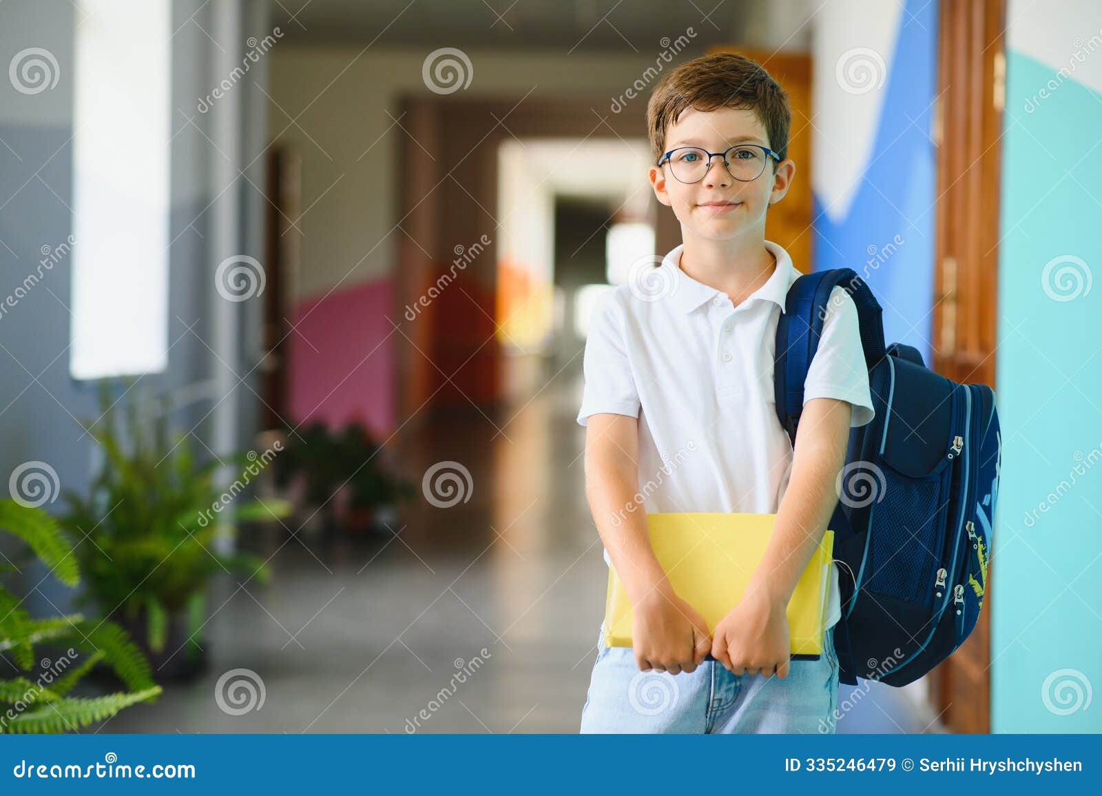Portrait Confident Schoolboy in School Corridor Stock Image - Image of ...