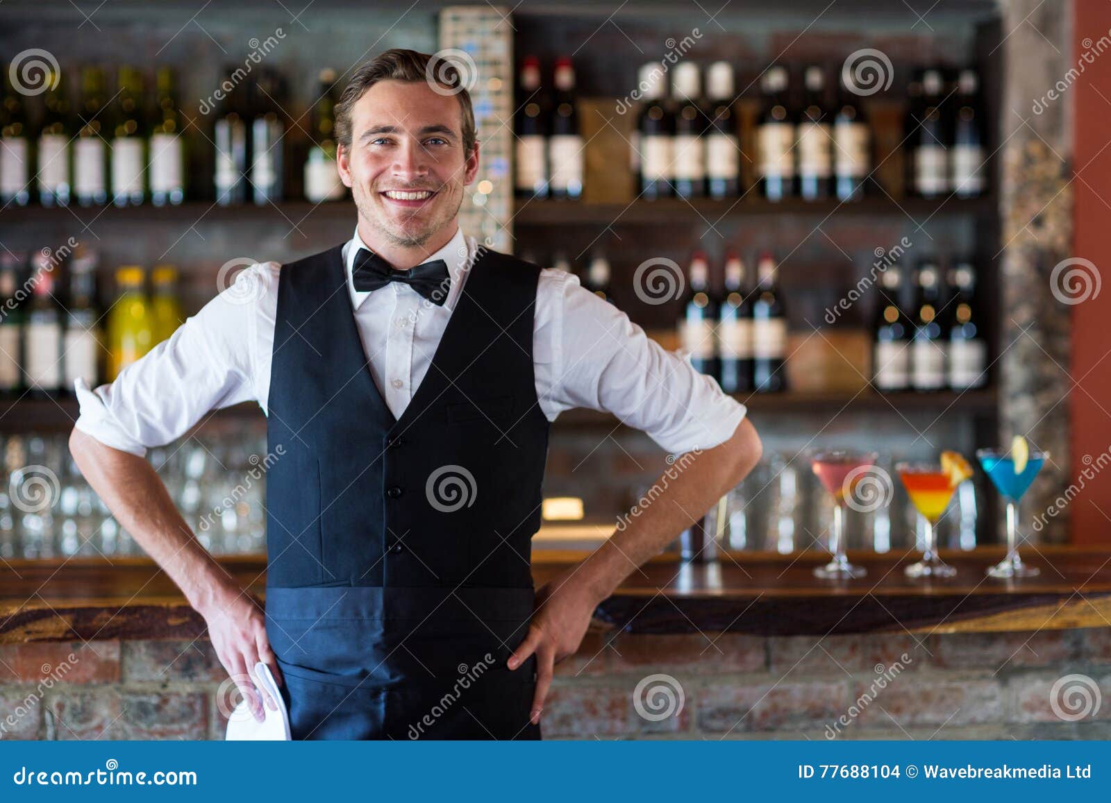 Portrait of Confident Waiter Standing with Hands on Hip Stock Photo ...