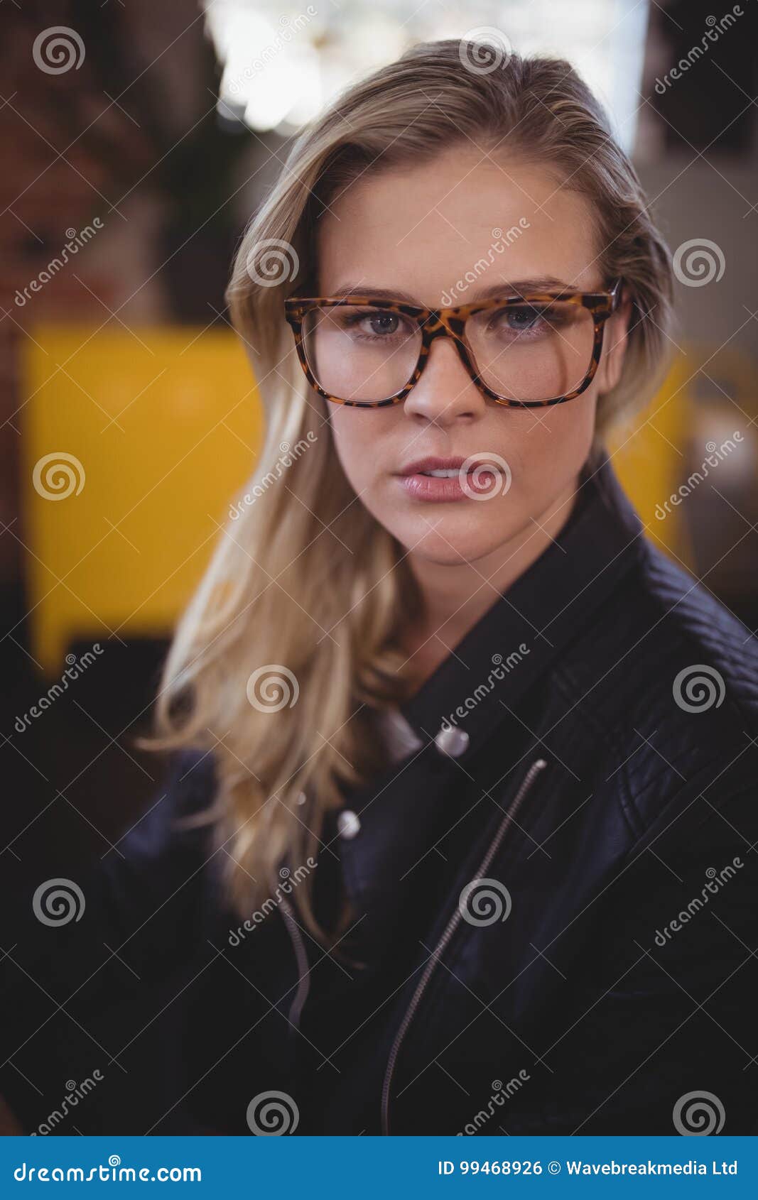 Portrait Of Confident Young Attractive Woman Wearing Eyeglasses Stock