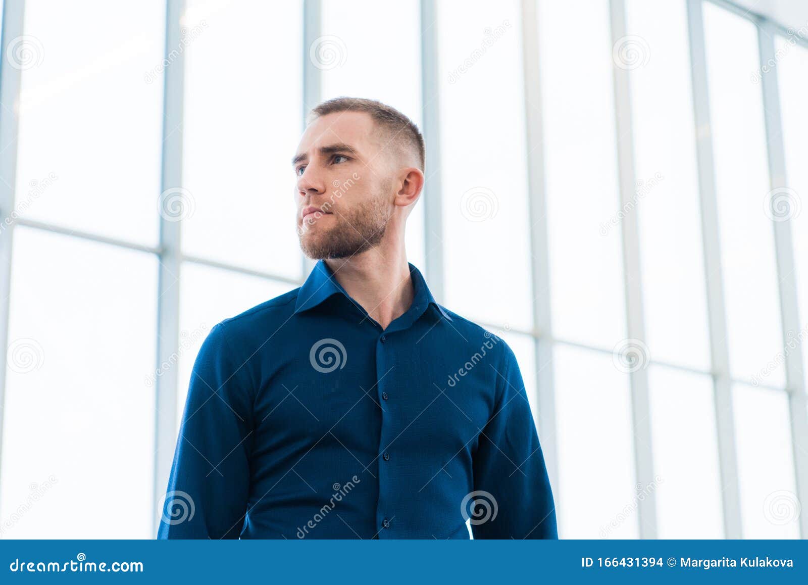 Portrait of a Confident Young Business Man Looking Away Stock Photo ... Portrait of a Confident Young Business Man Looking Away Stock Photo ...
