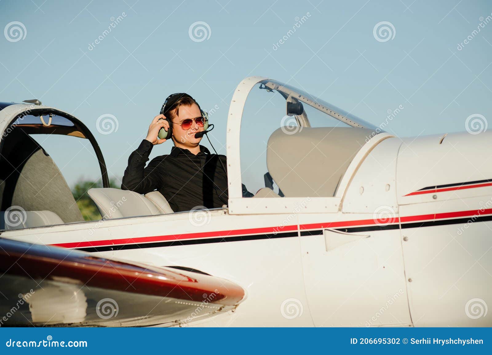 Portrait of Confident Young Man Pilot in Small Plane Stock Photo ...