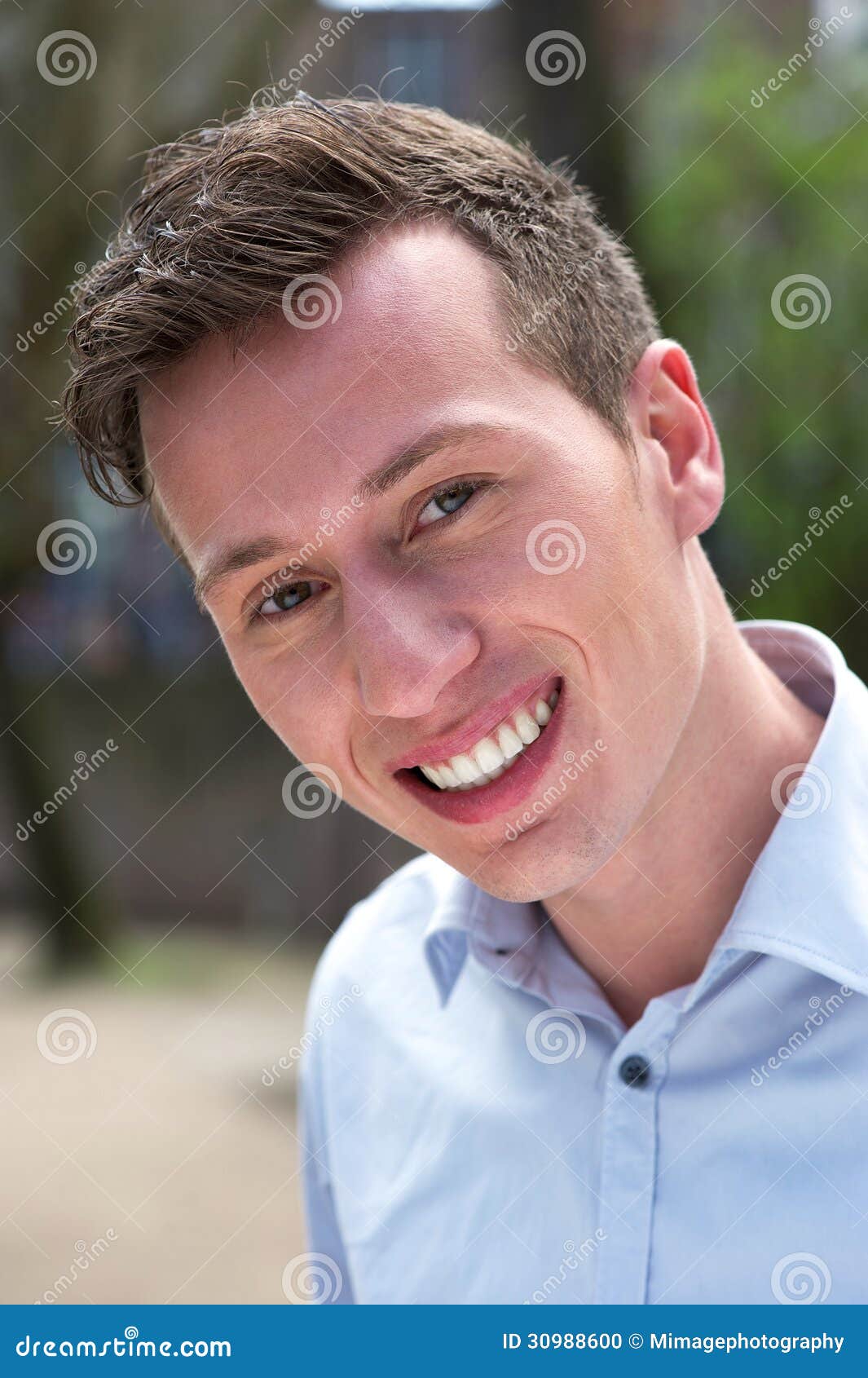 Portrait of a Confident Young Man Smiling Outdoors Stock Photo - Image ...